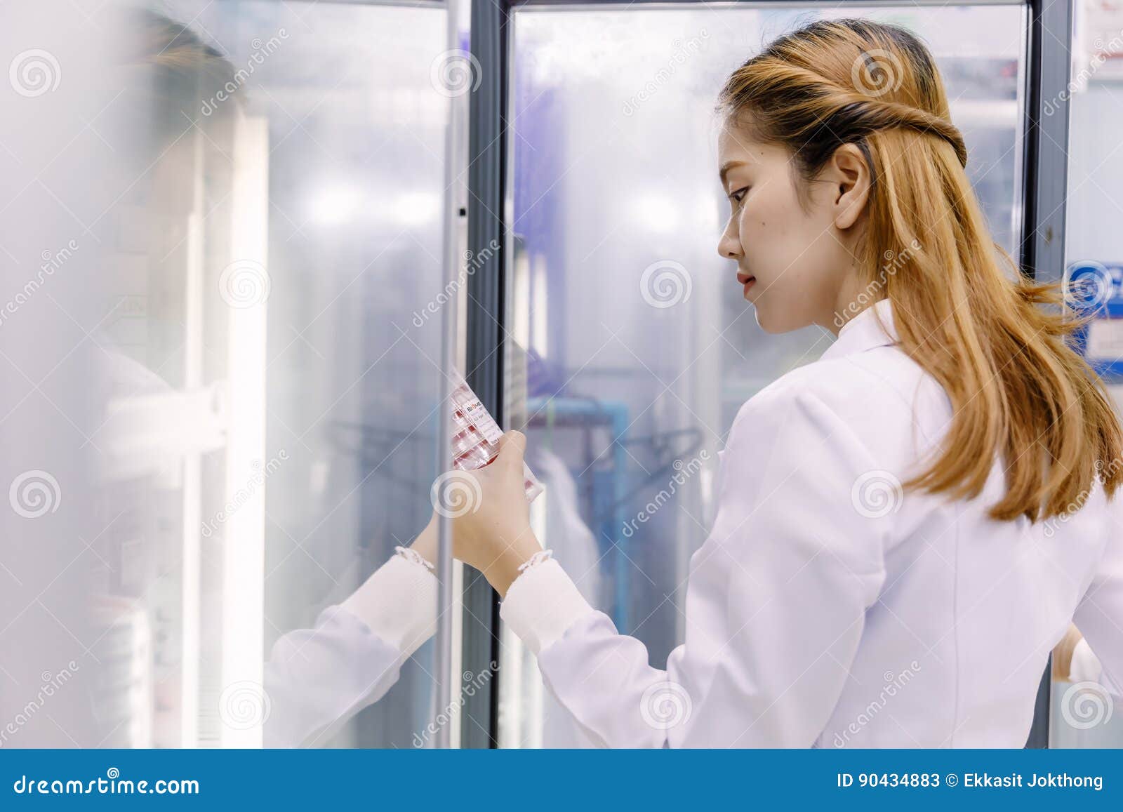 Young Asian Researcher Looking at the Flask in the Science Labor Stock ...