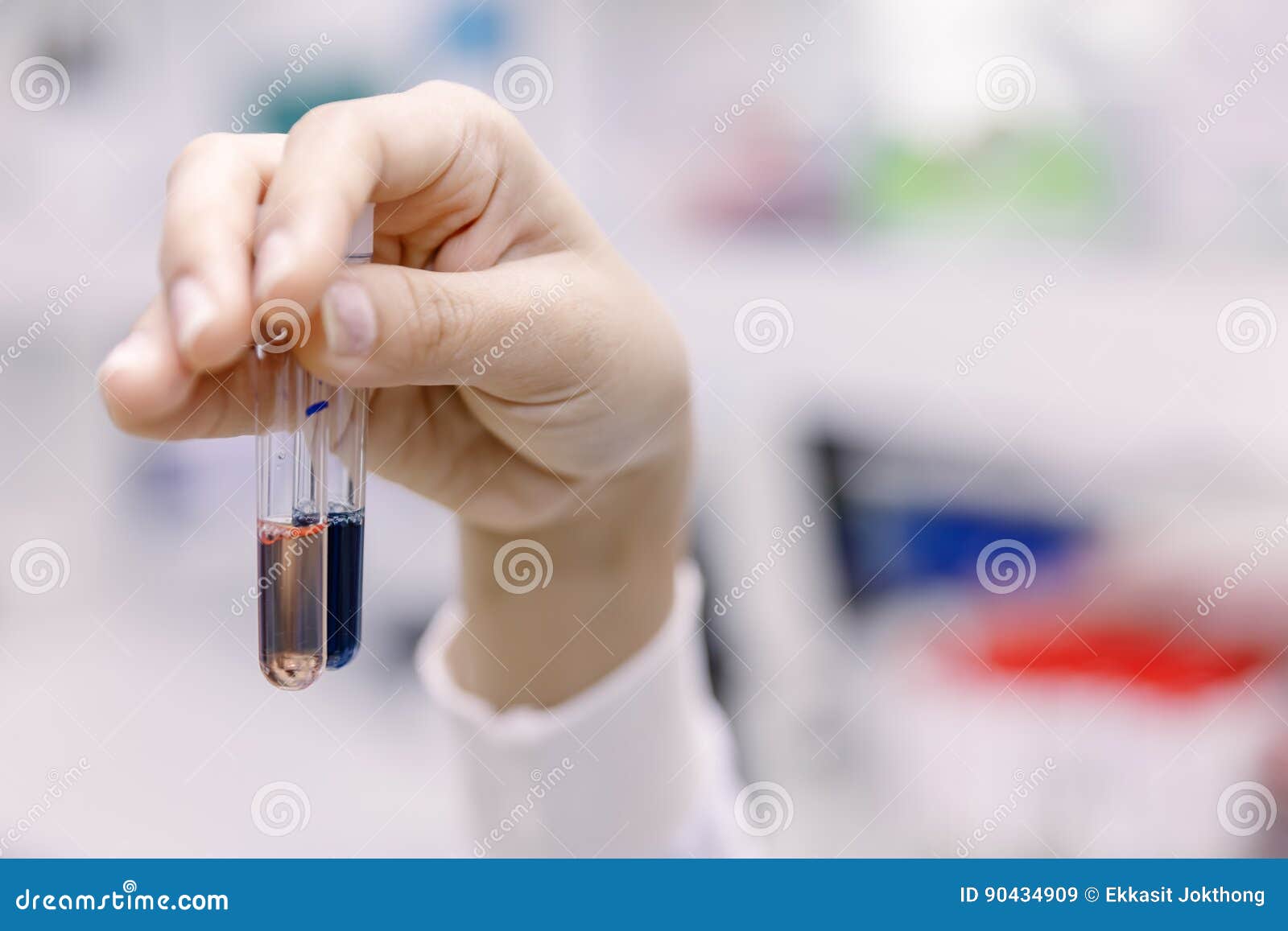 Young Asian Researcher Looking at the Flask in the Science Labor Stock ...