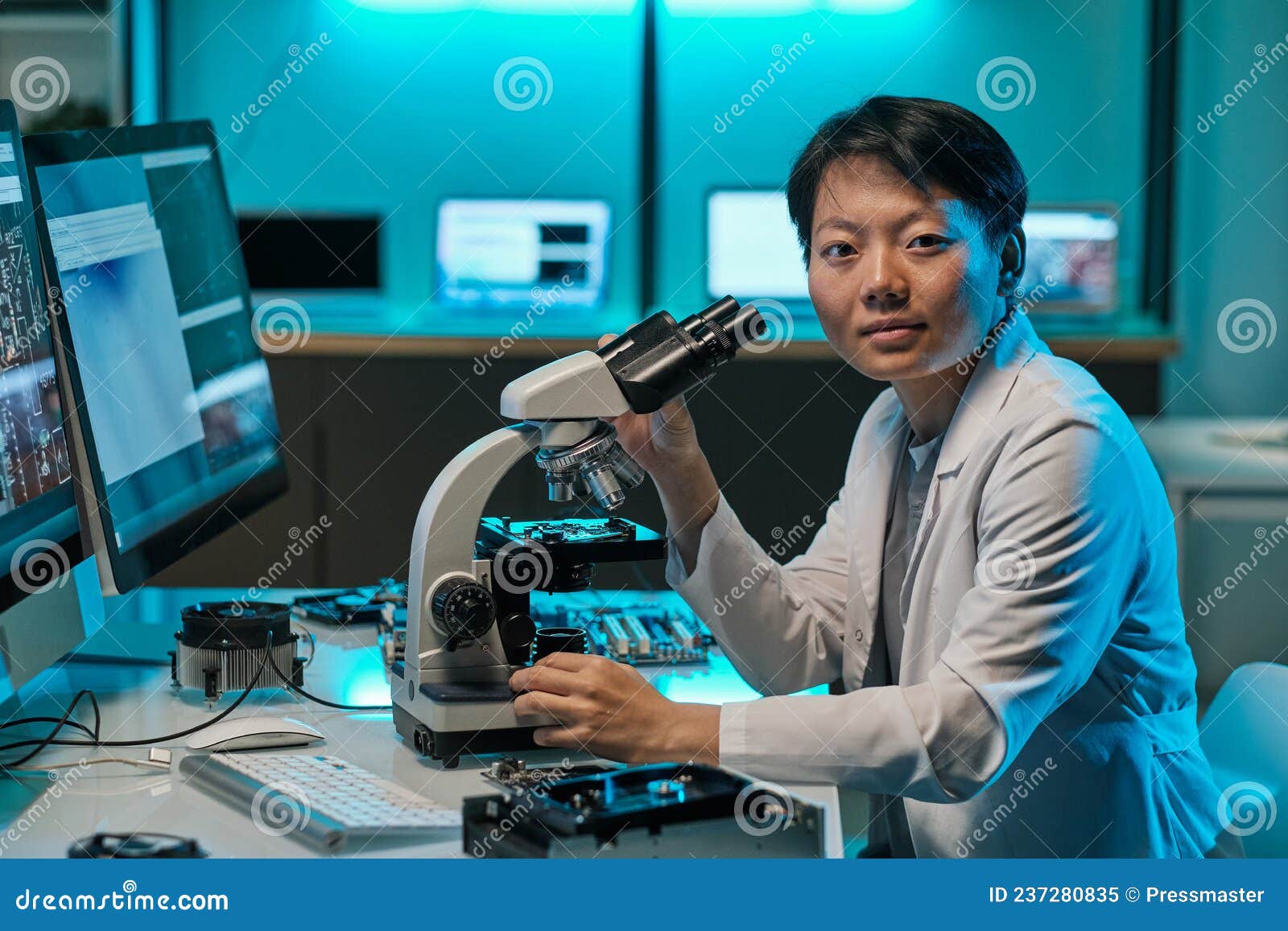Young Asian Researcher in Whitecoat Working with Microscope Stock Image ...