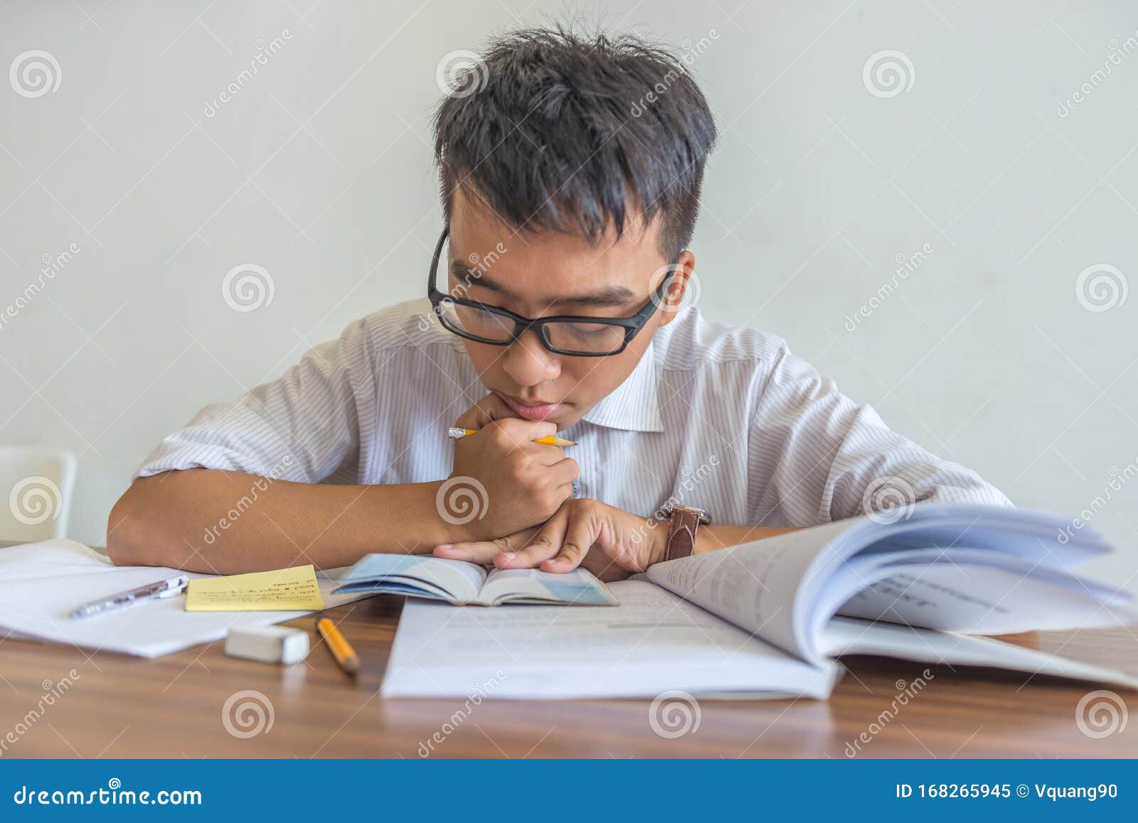 Young Asian Student Falling Asleep while Doing Homeworks Stock Image ...