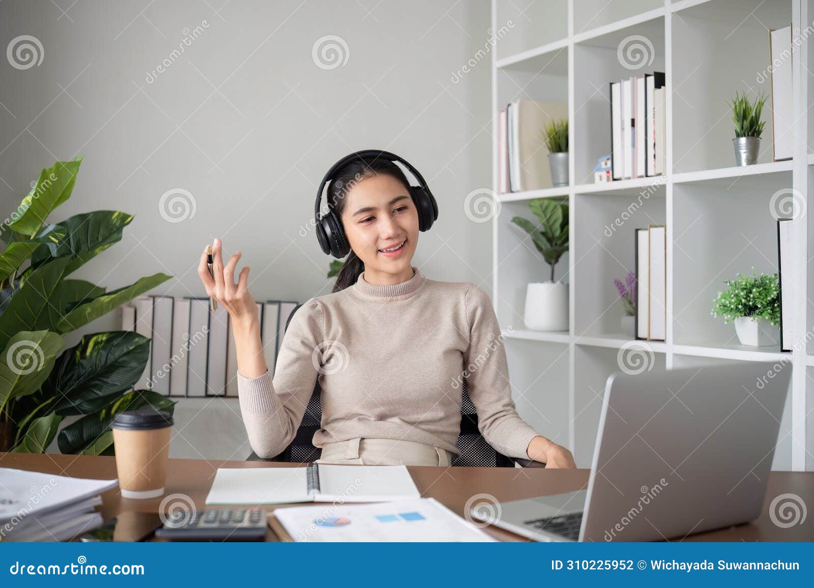 Young Asian Student Studies Online about Graphs and Statistics. Happy ...