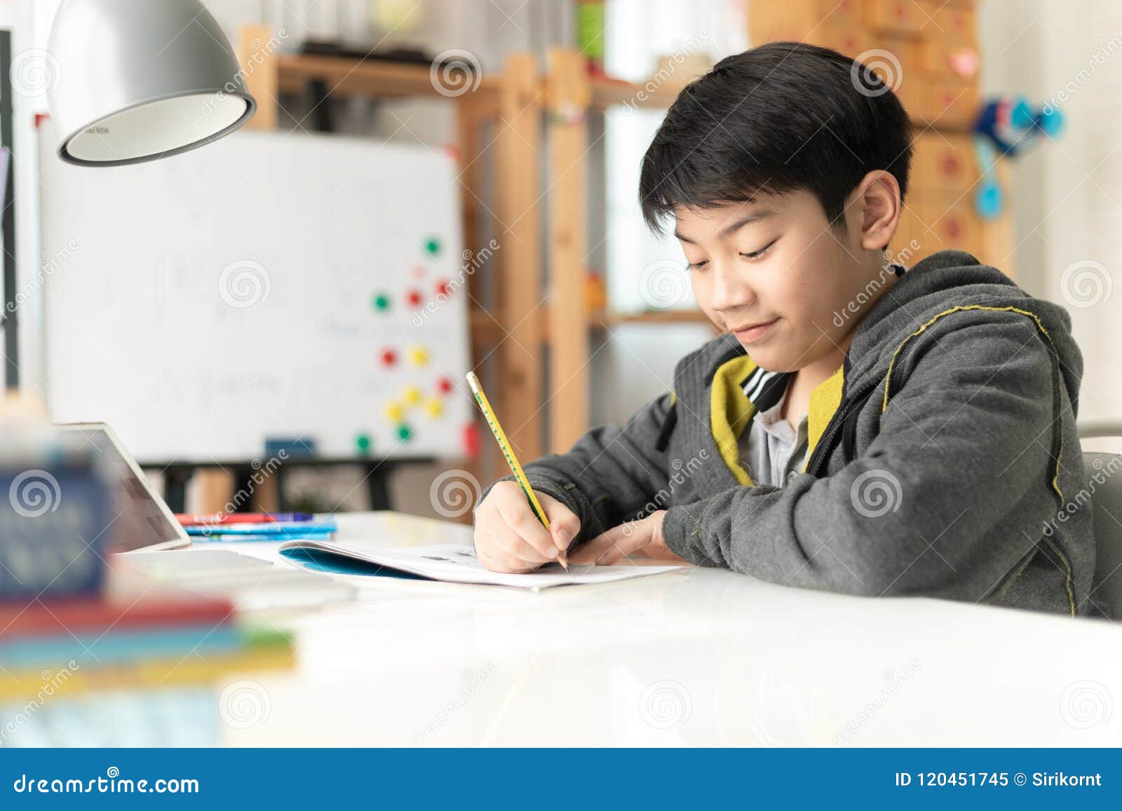 Young Asian Teenage Student Doing Homework . Stock Image - Image of ...