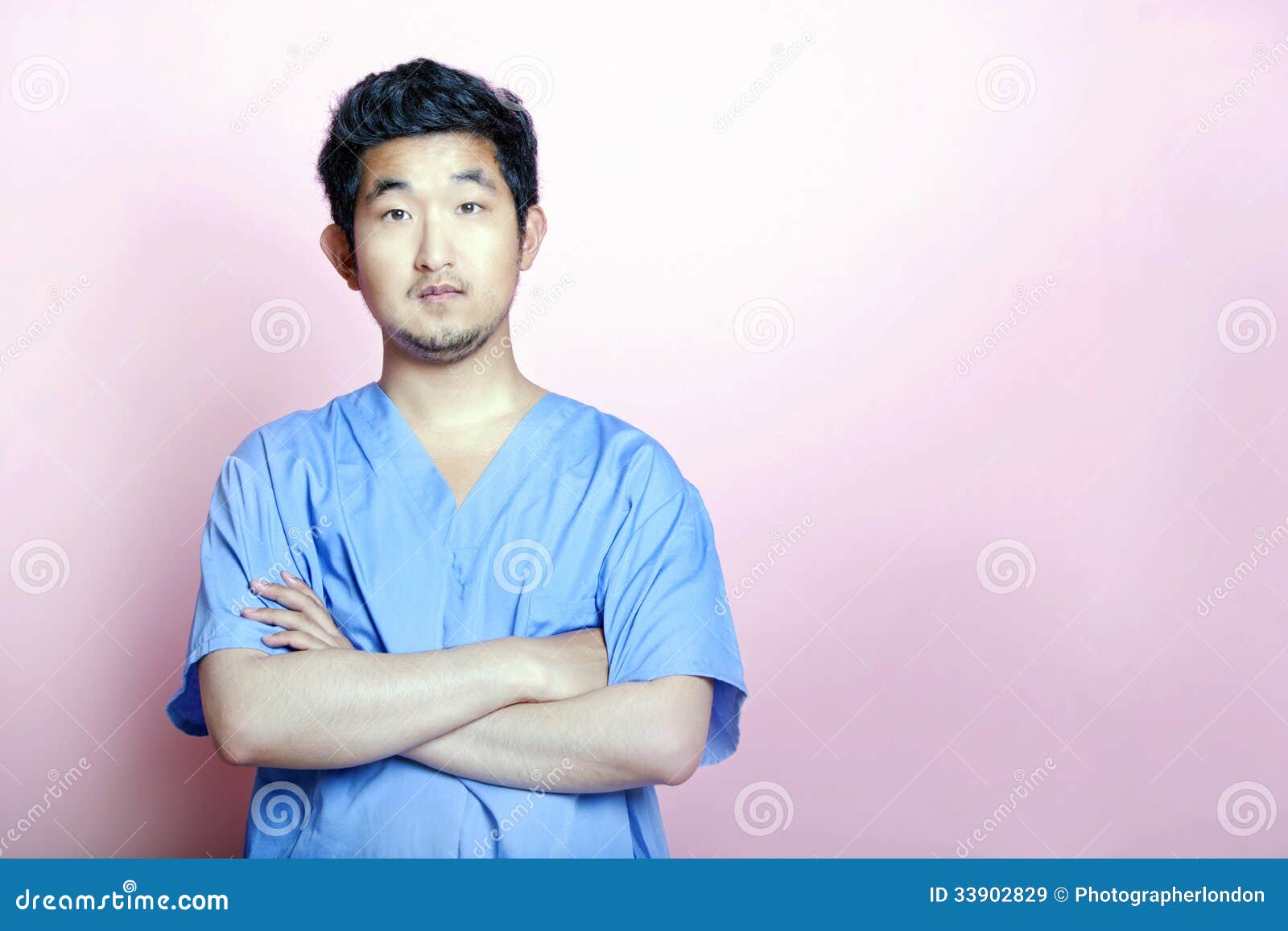 Young Asian Trainee Doctor Wearing Scrubs Stock Image - Image of folded ...