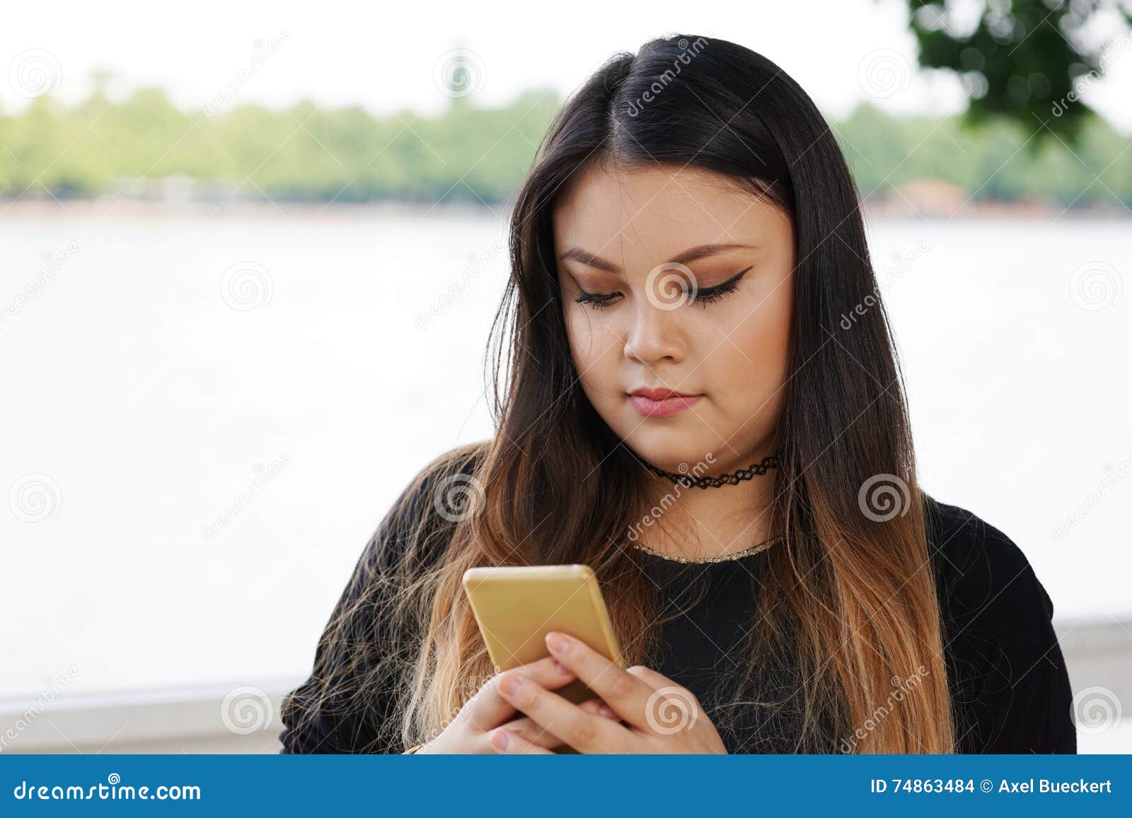 Young Asian Woman Checking Her Smartphone Stock Photo - Image of people ...