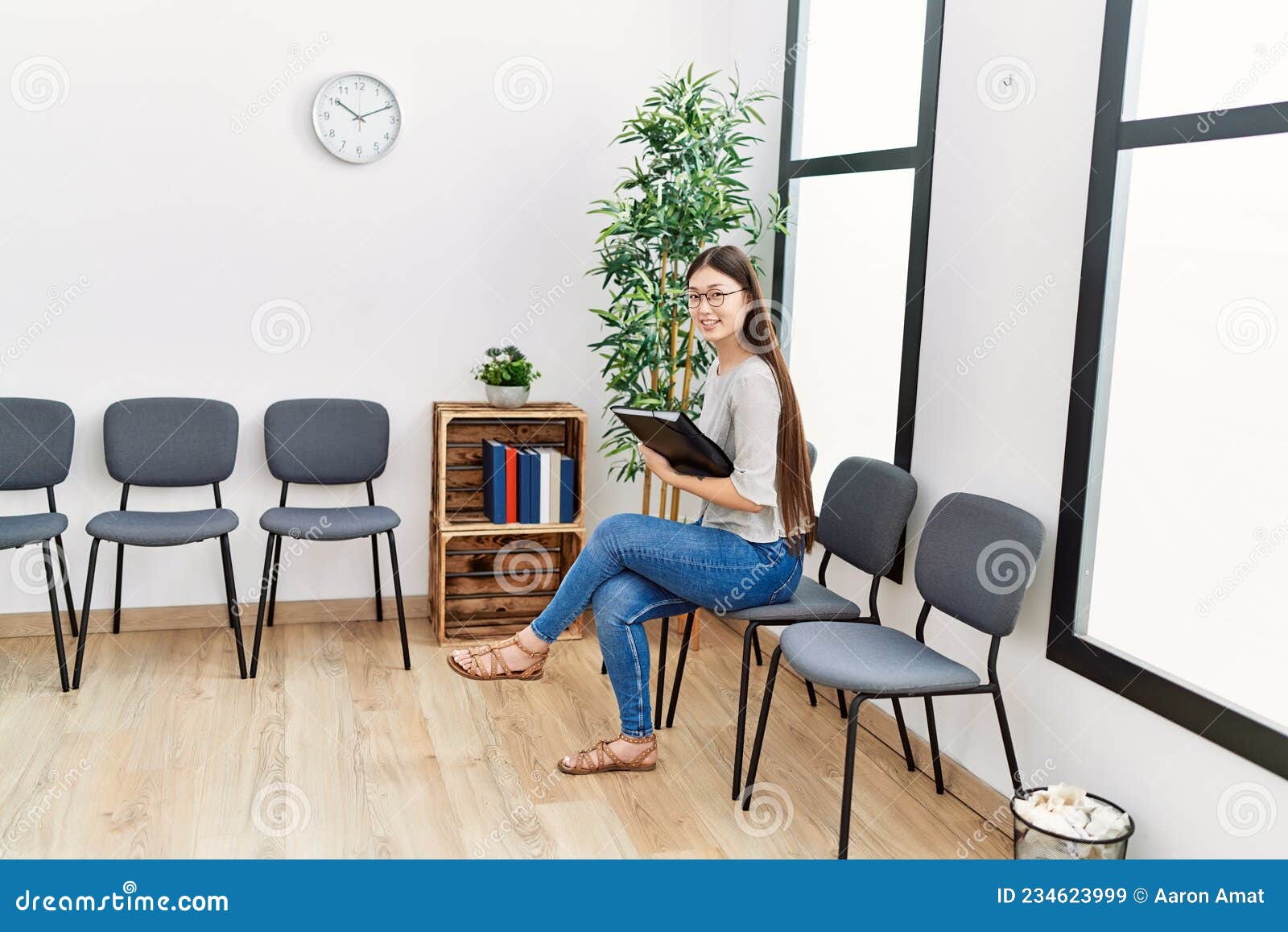 Young Asian Woman with Document Folder at Waiting Room Stock Image ...