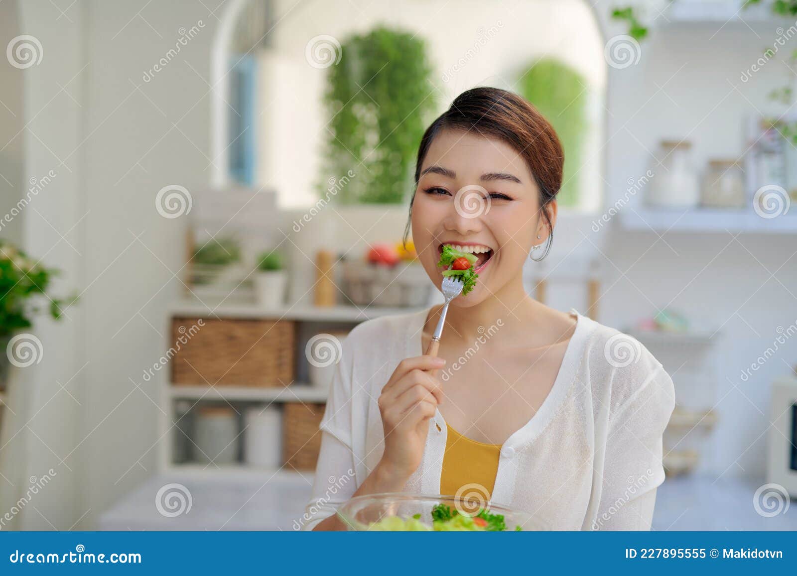Young Asian Woman Eating Salad Vegetable In Diet Concept Stock Image