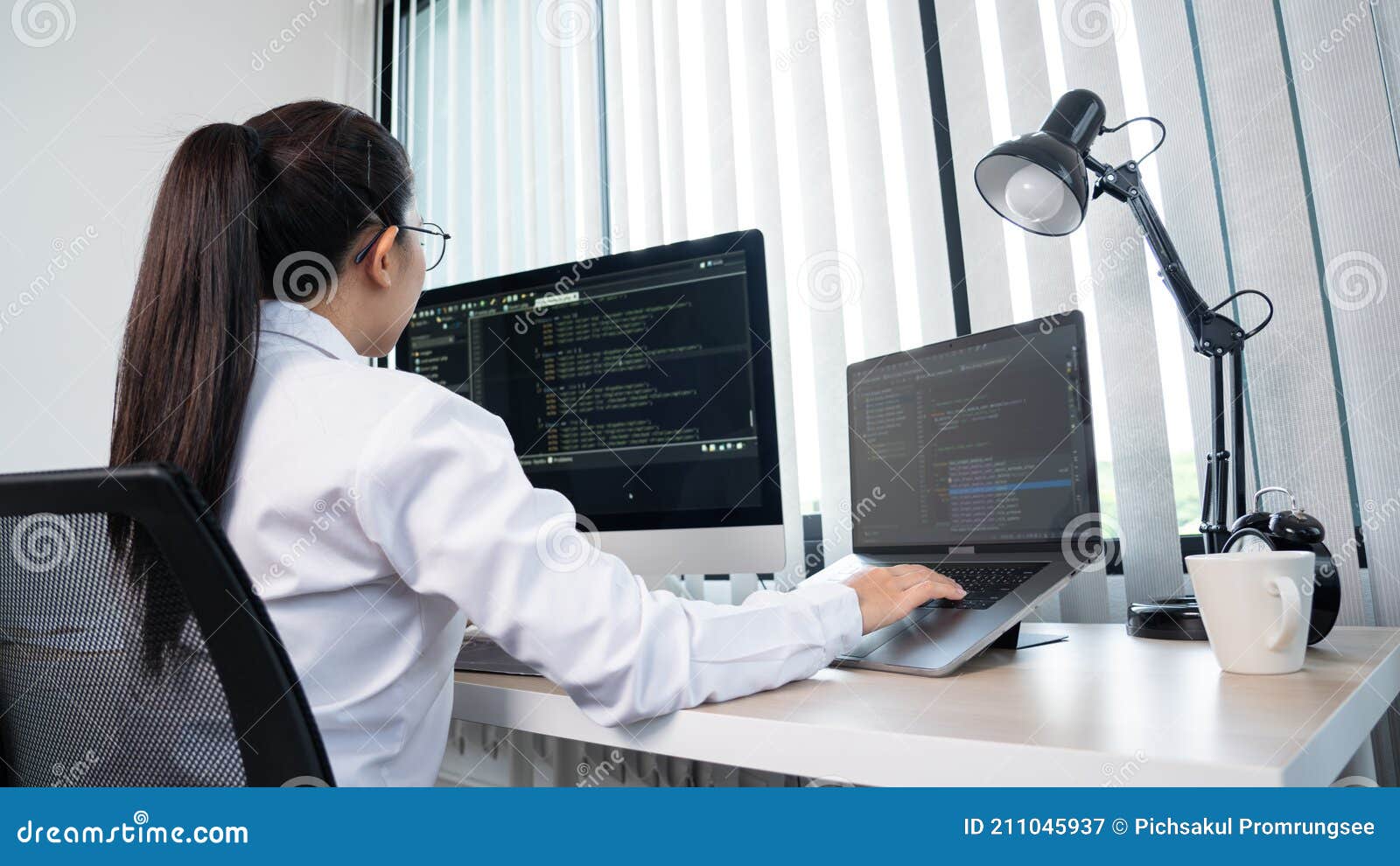 Young Asian Woman Programmer Typing Code Working with Computer at Table ...
