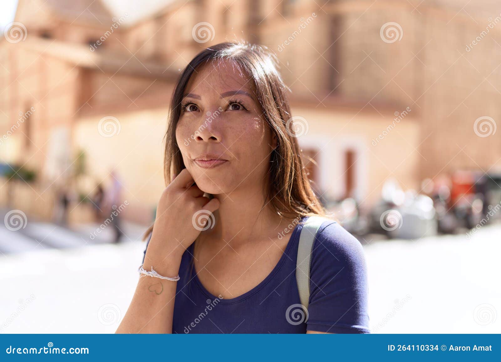 Young Asian Woman Standing with Doubt Expression at Street Stock Photo ...