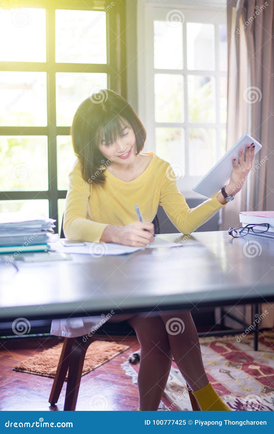 Young Asian Woman Students Using Tablets and Writing Note in College ...