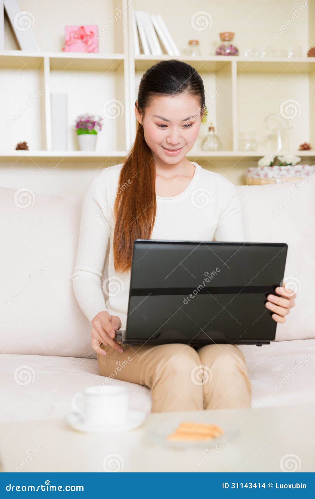 Young Asian Woman Using a Laptop Stock Photo - Image of domestic, woman ...