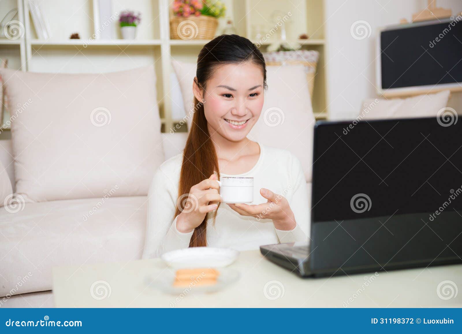 Young Asian Woman Using a Laptop Stock Photo - Image of computer, room ...