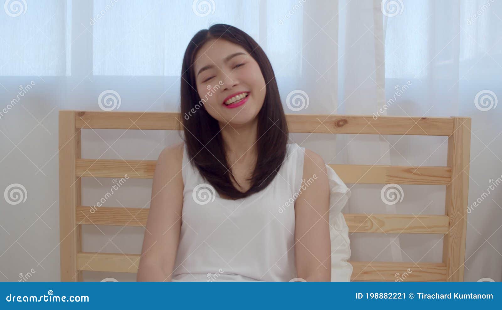 Young Asian Woman Watching Tv At Home Female Feeling Happy Lying On