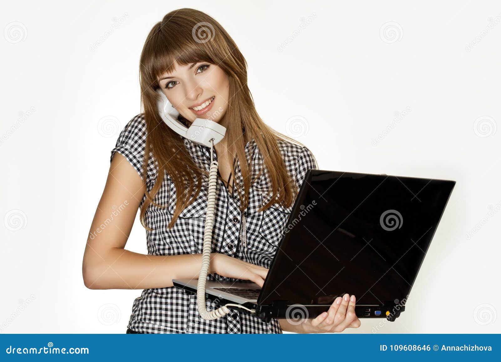 Young Assistant Doing Multiple Tasks at the Same Time. Talking on the ...