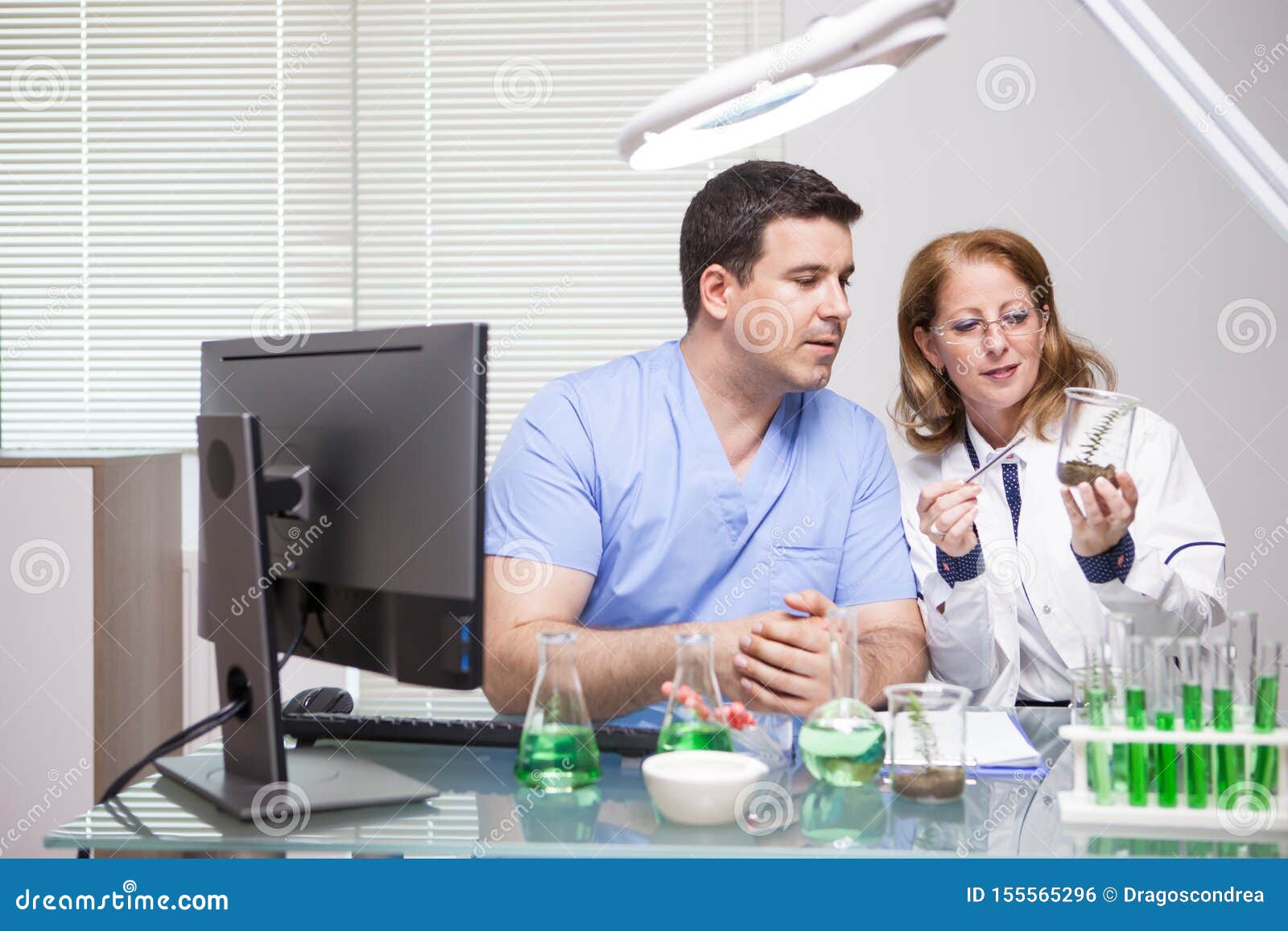 Young Assistant Paying Attention To Leading Scientist Stock Photo ...