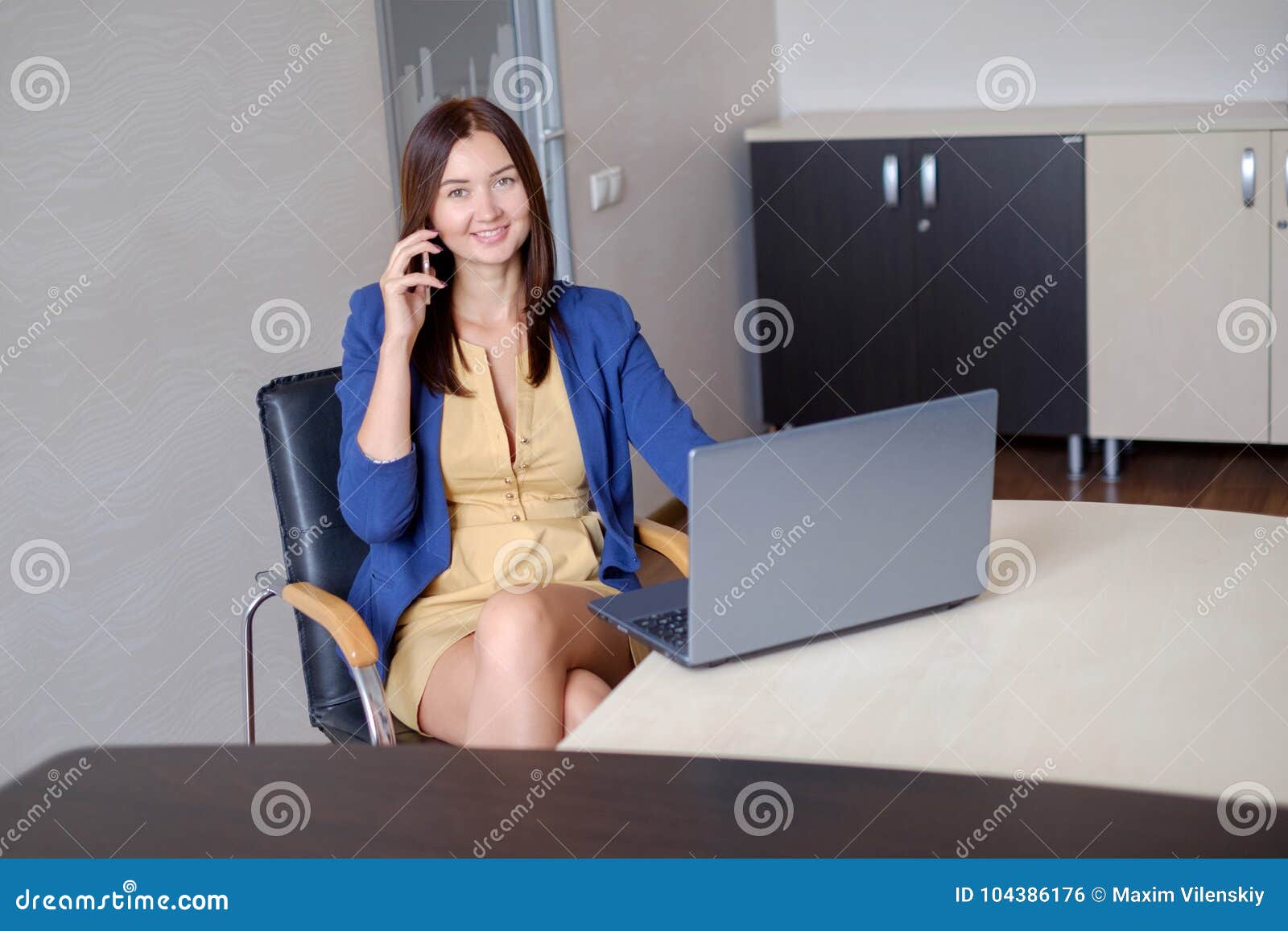 Young Assistant Working in the Office at Laptop Stock Photo - Image of ...