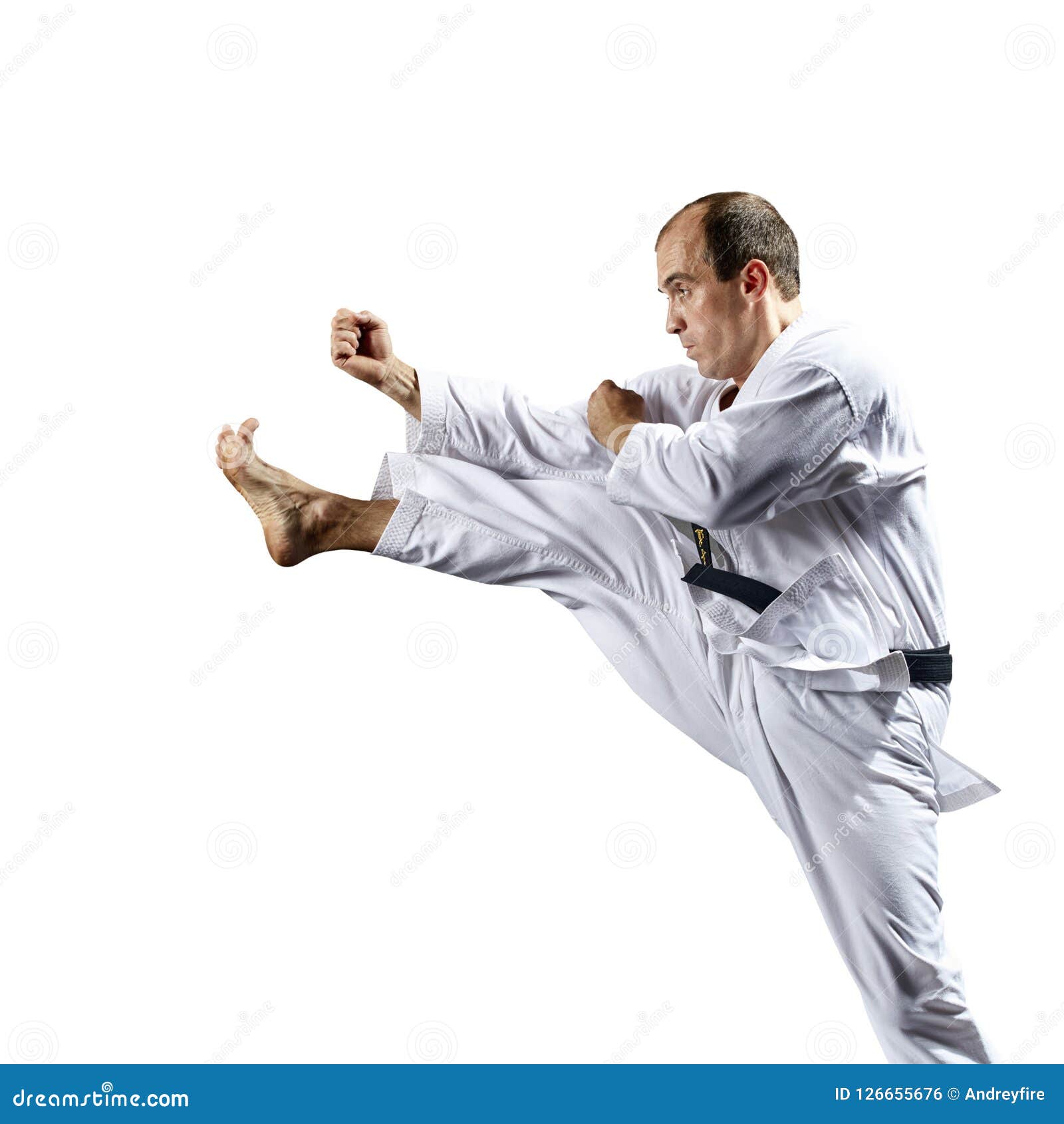 Young Athlete Strikes with a Kick Forward on a White Background ...