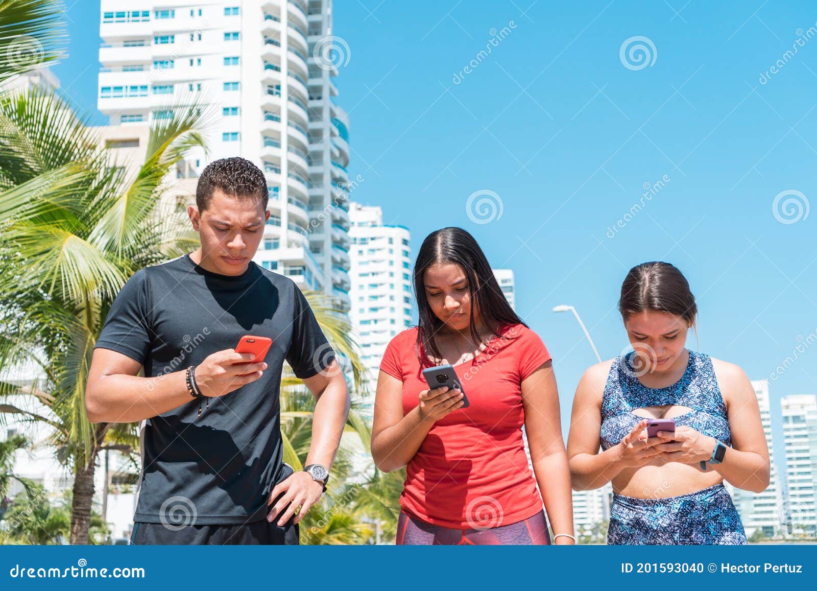 Young Athletes in the Park Using Their Phones Stock Photo - Image of ...