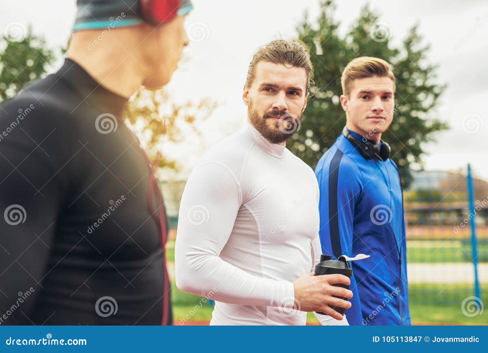 Athletes Practicing a Run on Athletics Stadium Track. Stock Image ...