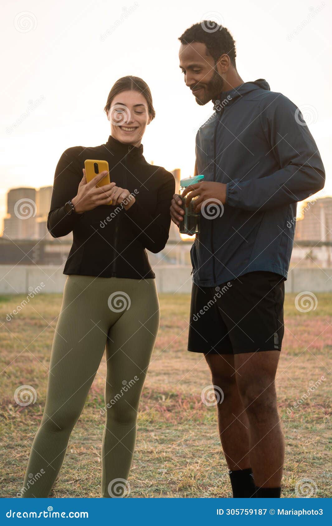 Young Athletes Using Apps on the Phone To Keep Track of Their Exercise ...