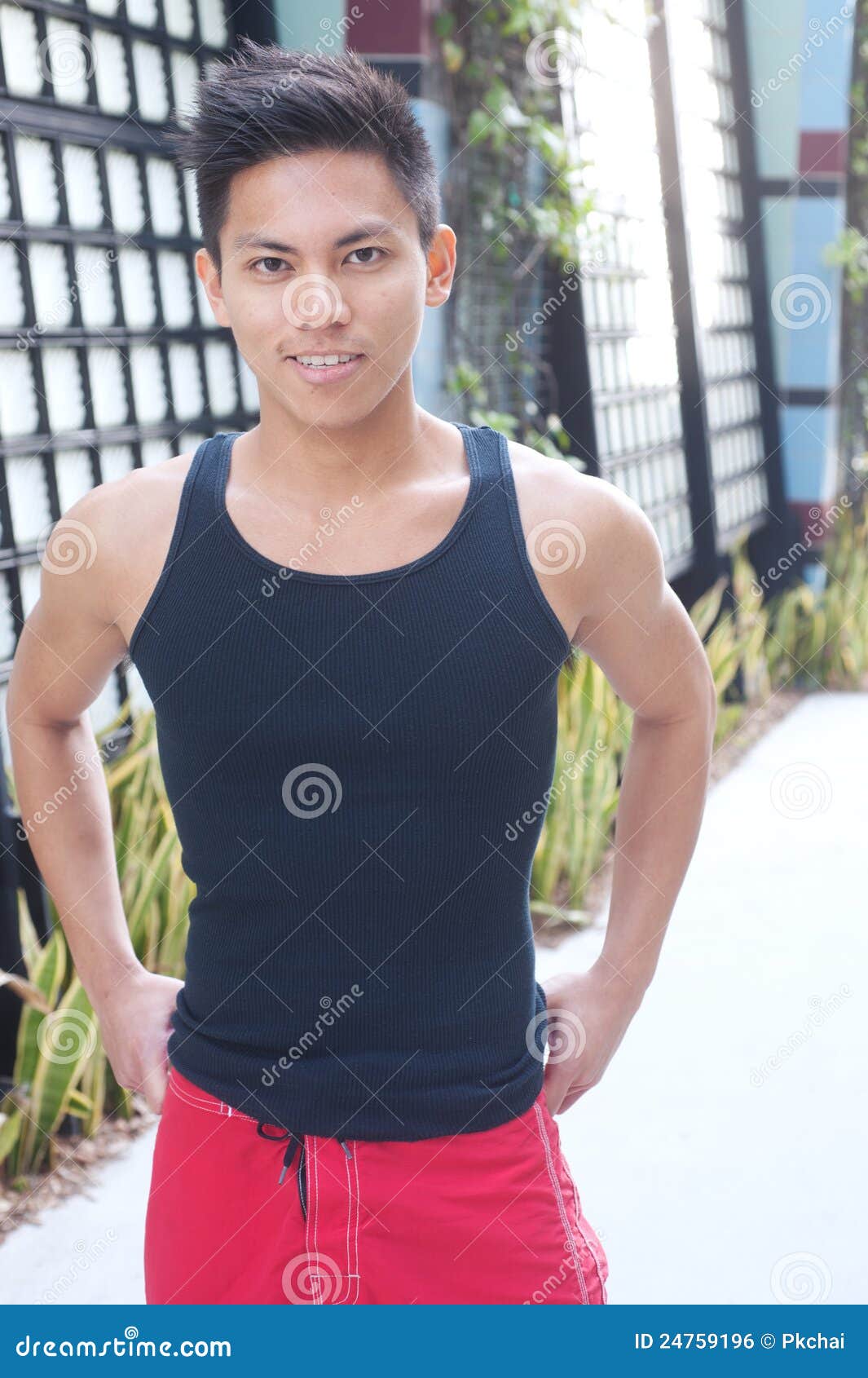 Athletic Asian Runner Sprinter Crossing The Finish Line. Royalty-Free ...