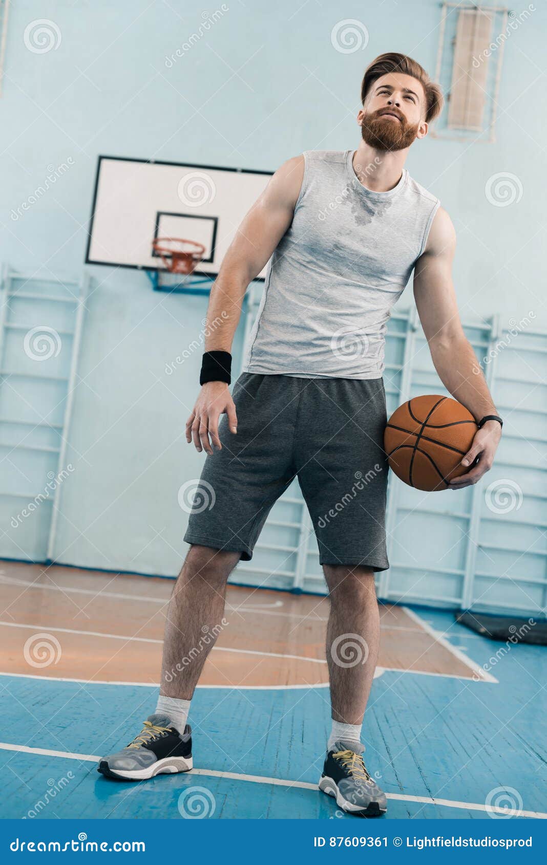 Young Athletic Basketball Player Standing with Ball Stock Image - Image ...