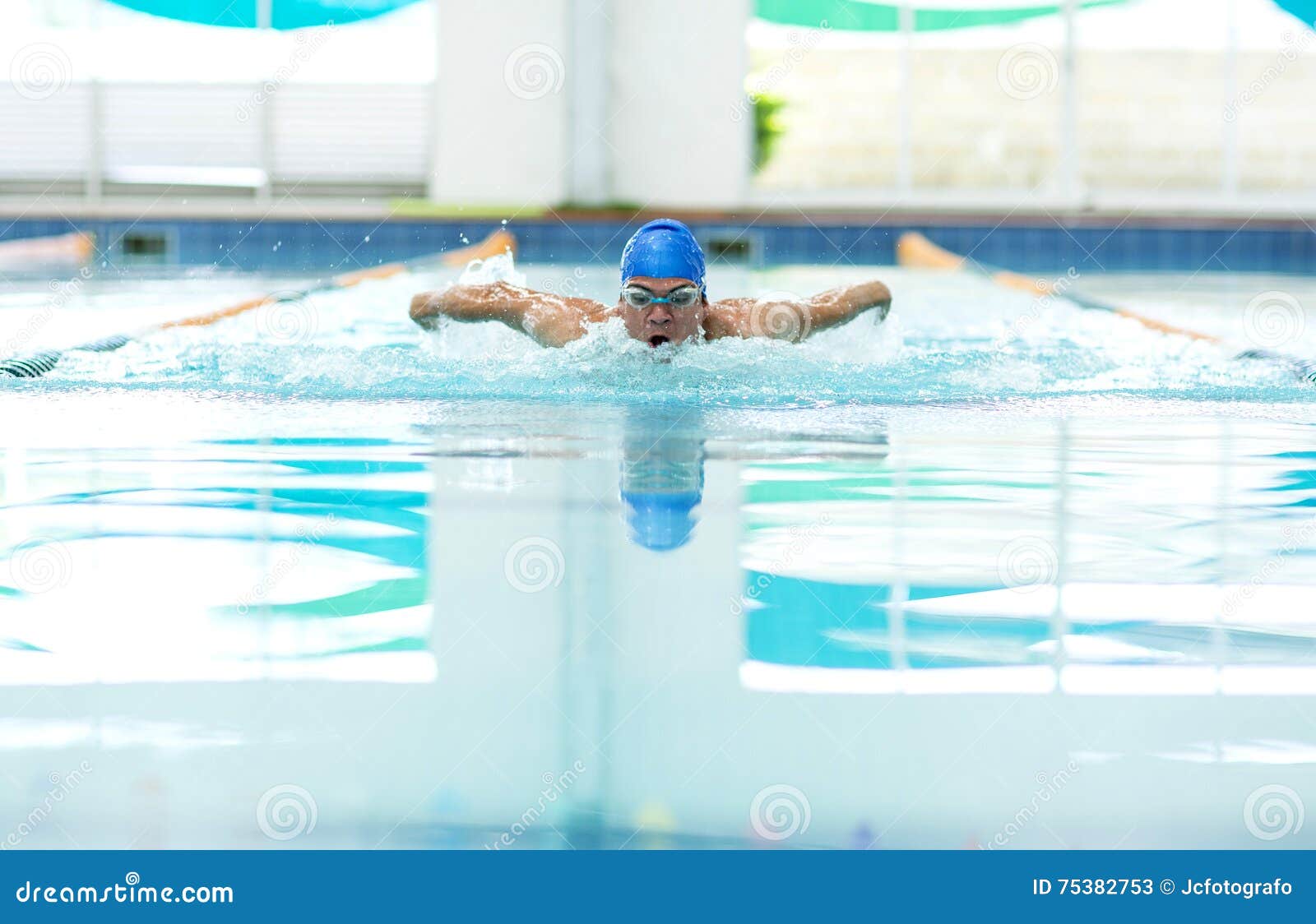 Young Athletic Man with Butterfly Swimming Technique. Stock Image ...