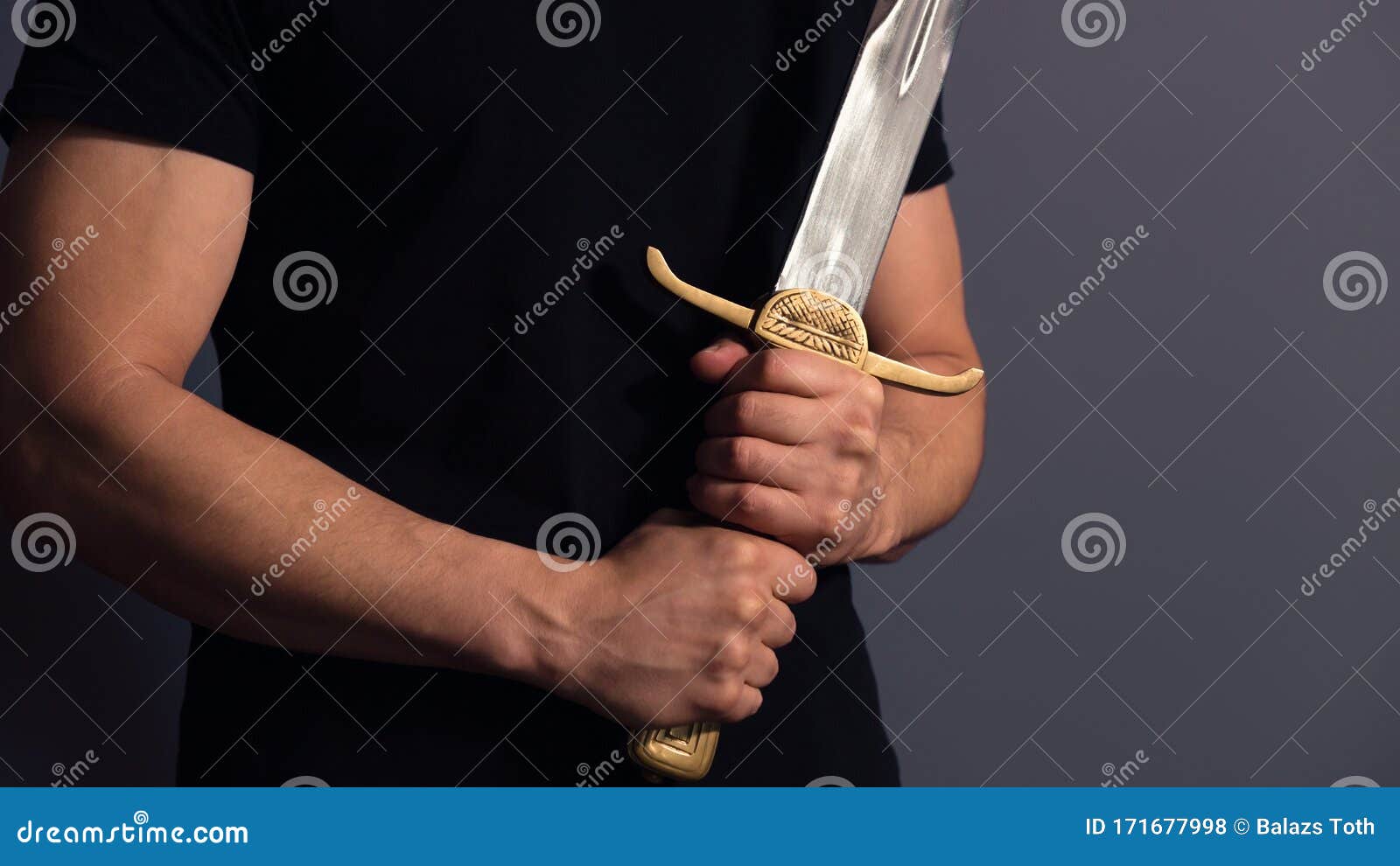 Young Athletic Man Holding His Sword Stock Photo - Image of religion ...
