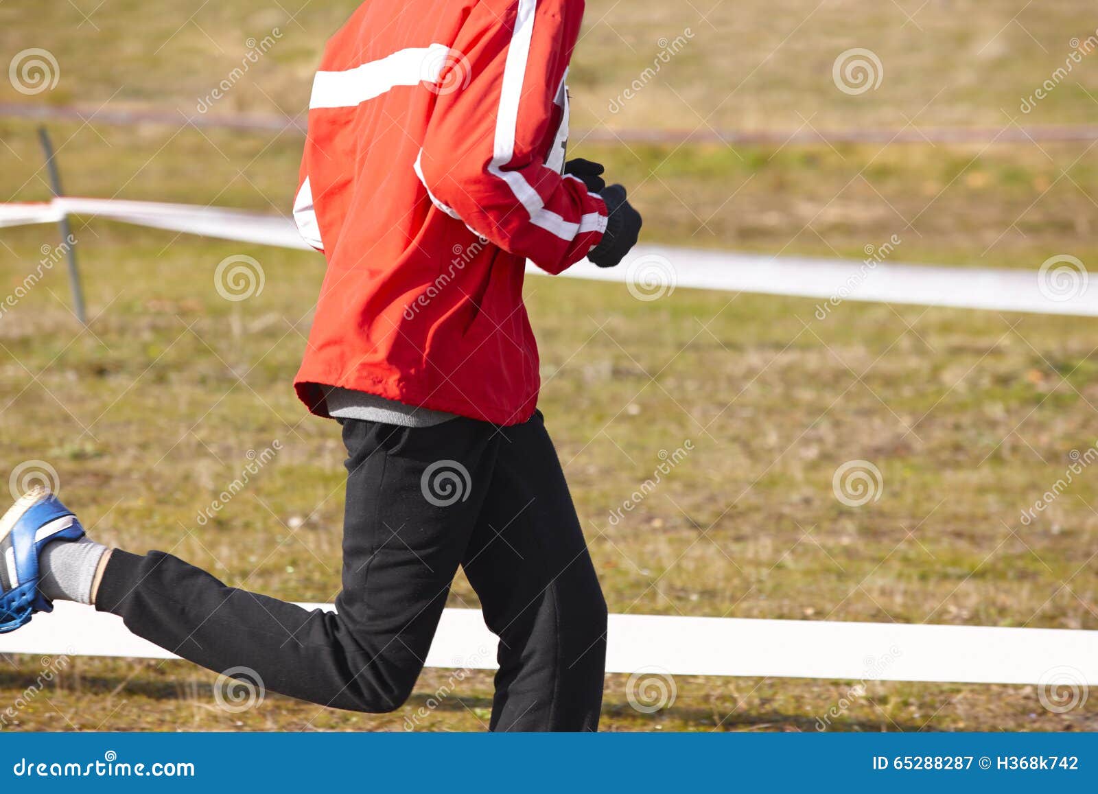 Young Athletic Runner with Number on a Race. Outdoor Circuit Stock ...