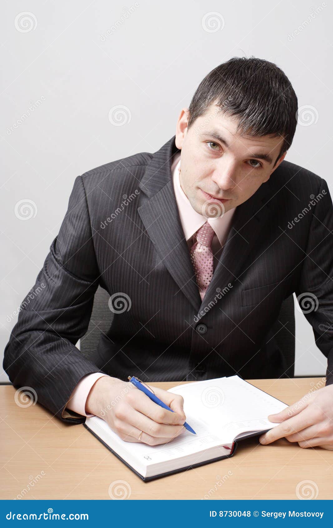Young Attentive Man with Organizer Stock Photo - Image of writing, hand ...