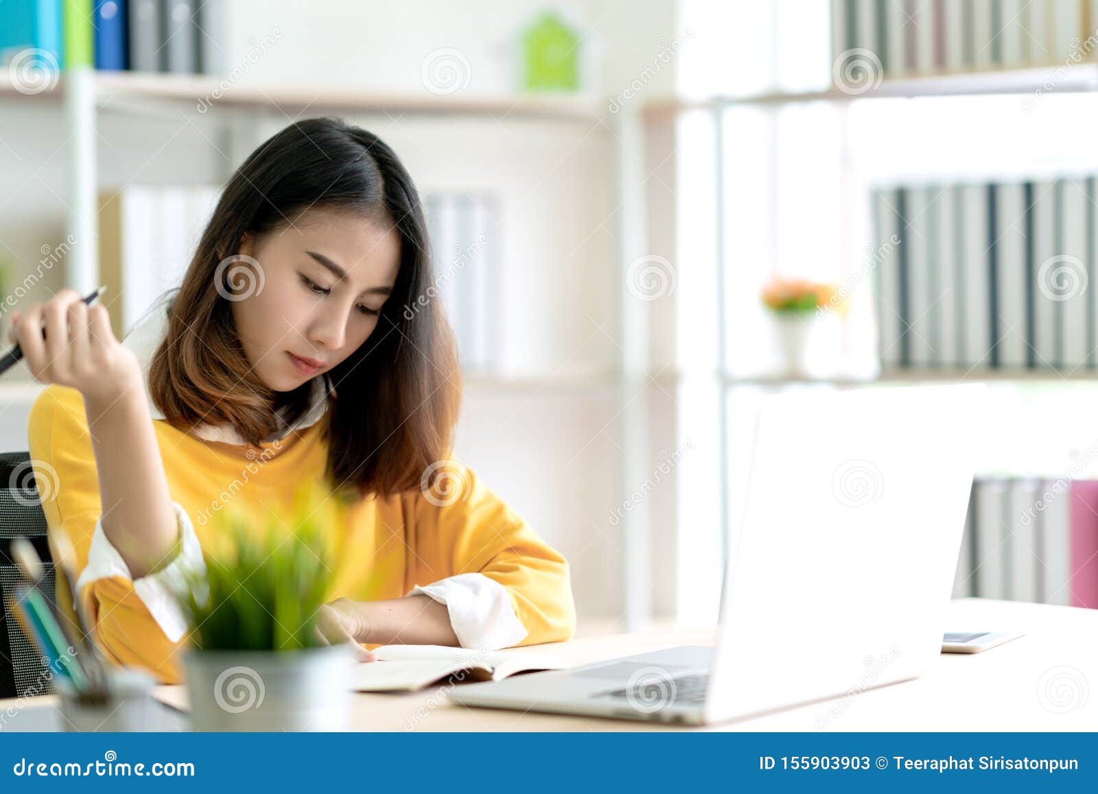 Young Attractive Asian Woman or Student Working on Thesis Assignment or ...