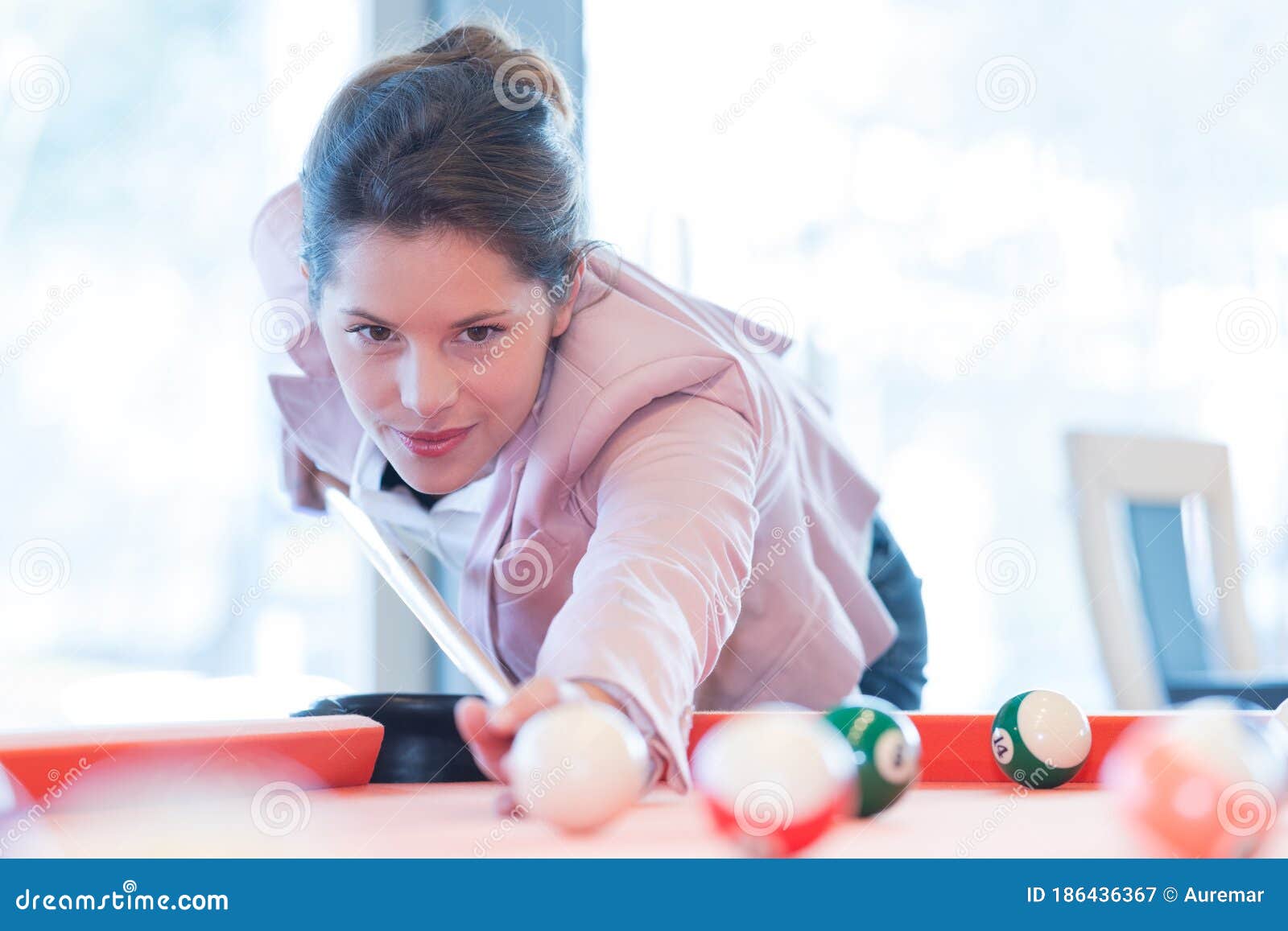 Young Attractive Brunette Woman Playing Billiards Pool Game Stock Image