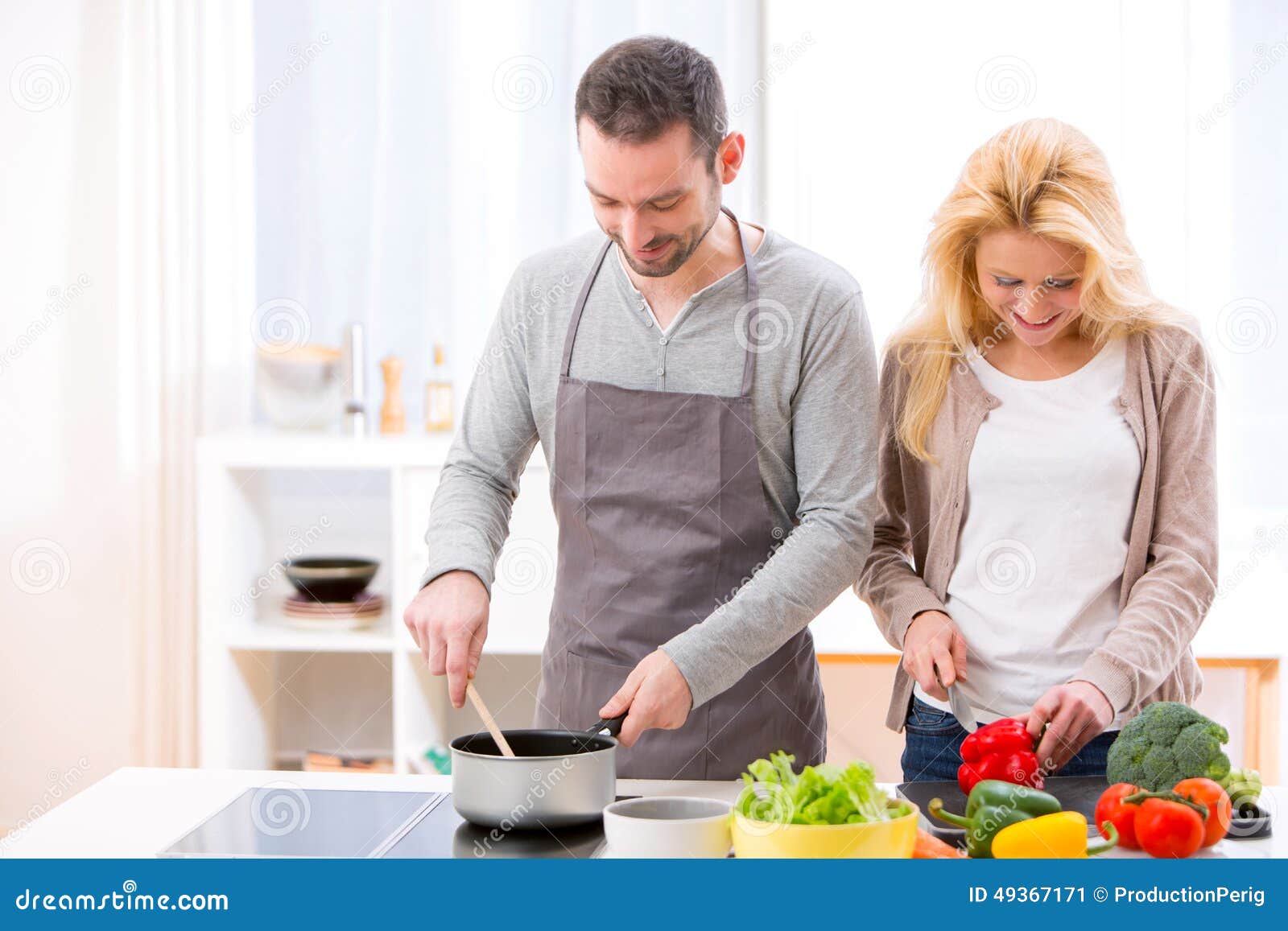 Young Attractive Couple Cooking in a Kitchen Stock Image - Image of ...