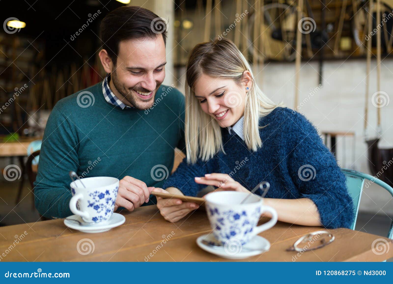 Young Attractive Couple on Date in Coffee Shop Stock Image - Image of ... Young Attractive Couple on Date in Coffee Shop Stock Image - Image of ...