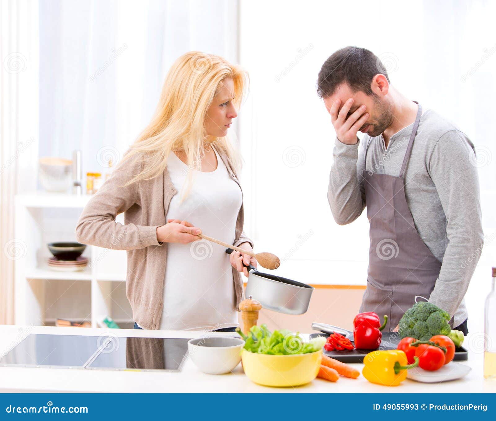 Young Attractive Couple Having an Argue while Cooking Stock Image ...