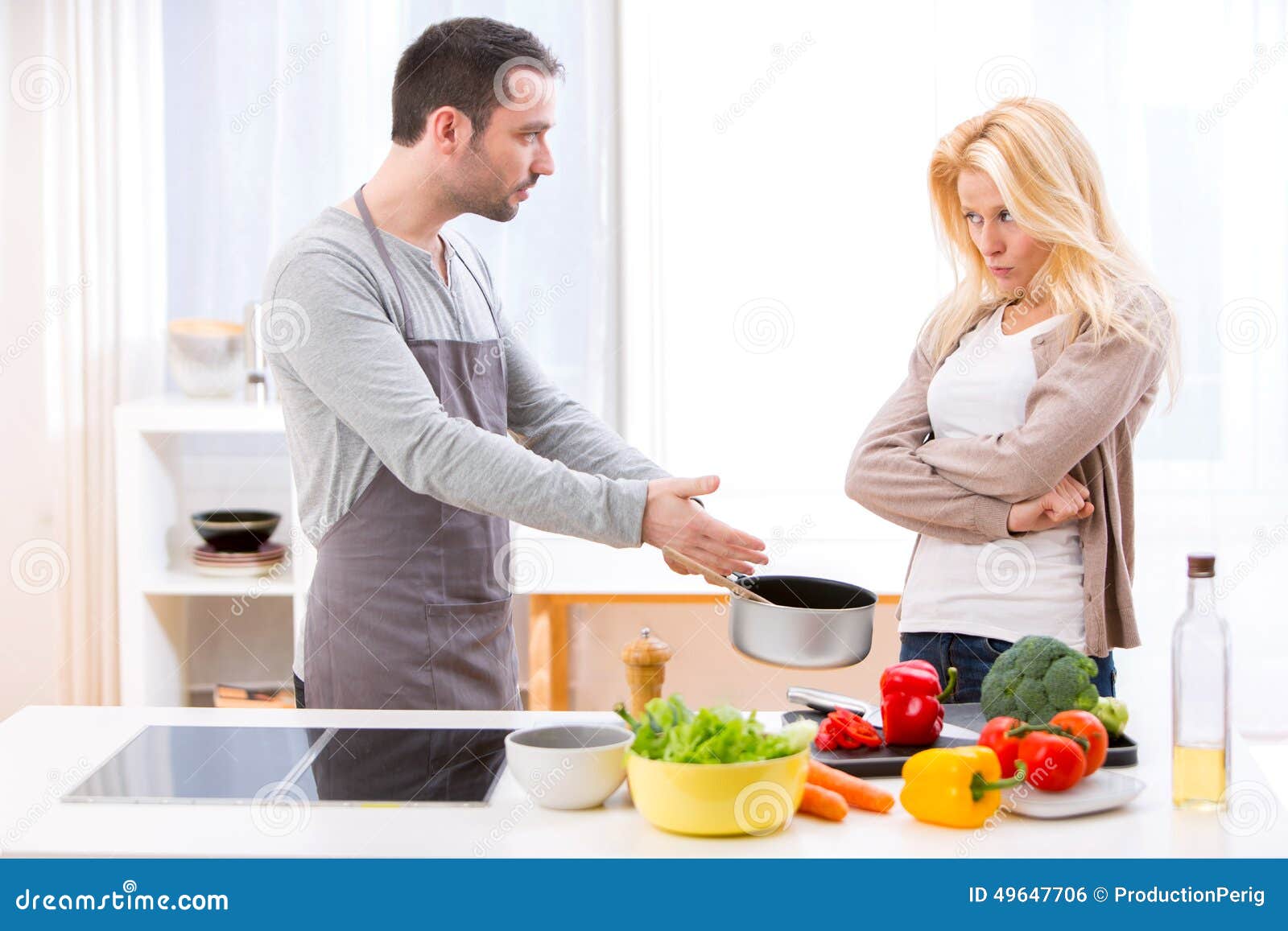Young Attractive Couple Having an Argue while Cooking Stock Photo ...