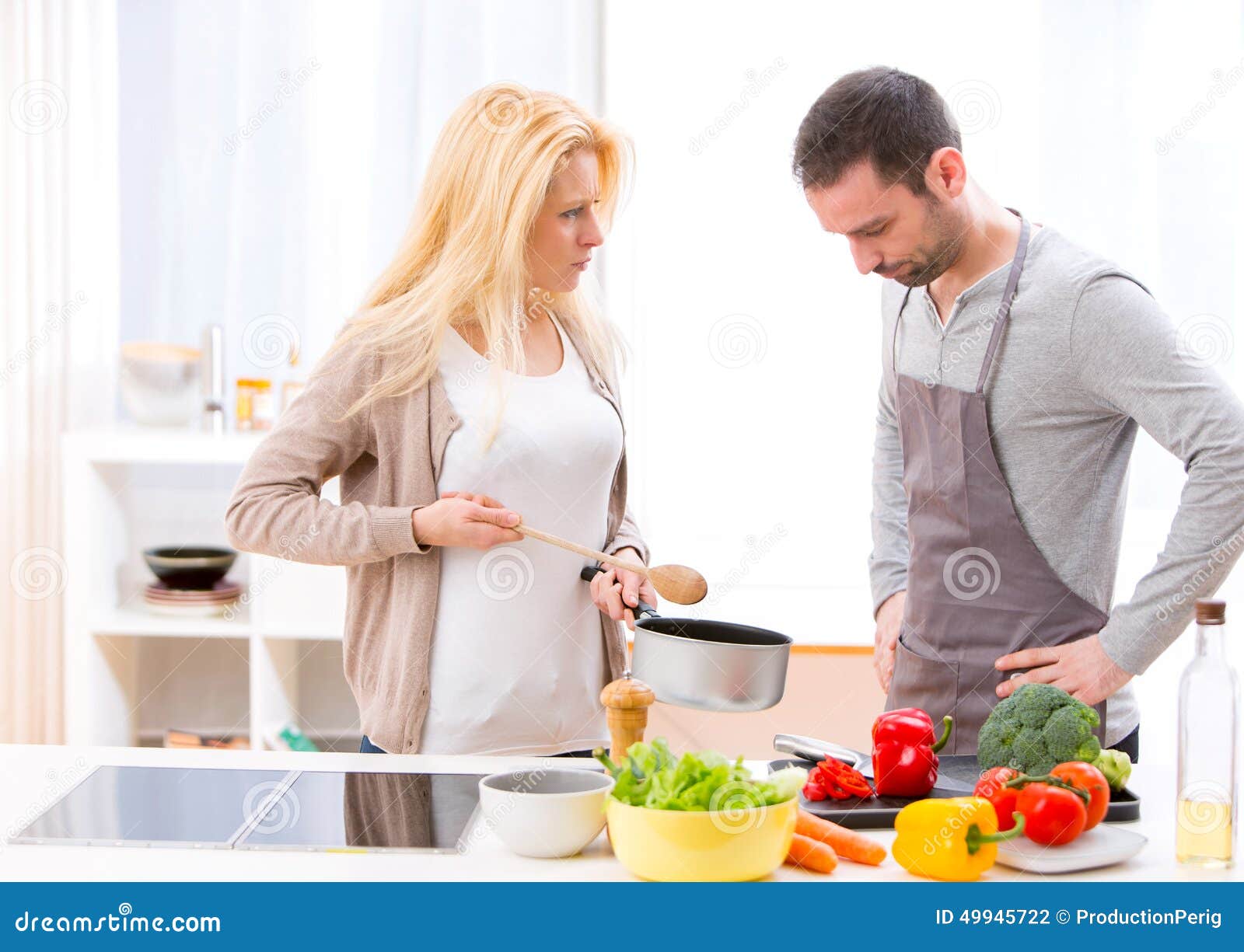 Young Attractive Couple Having an Argue while Cooking Stock Photo ...