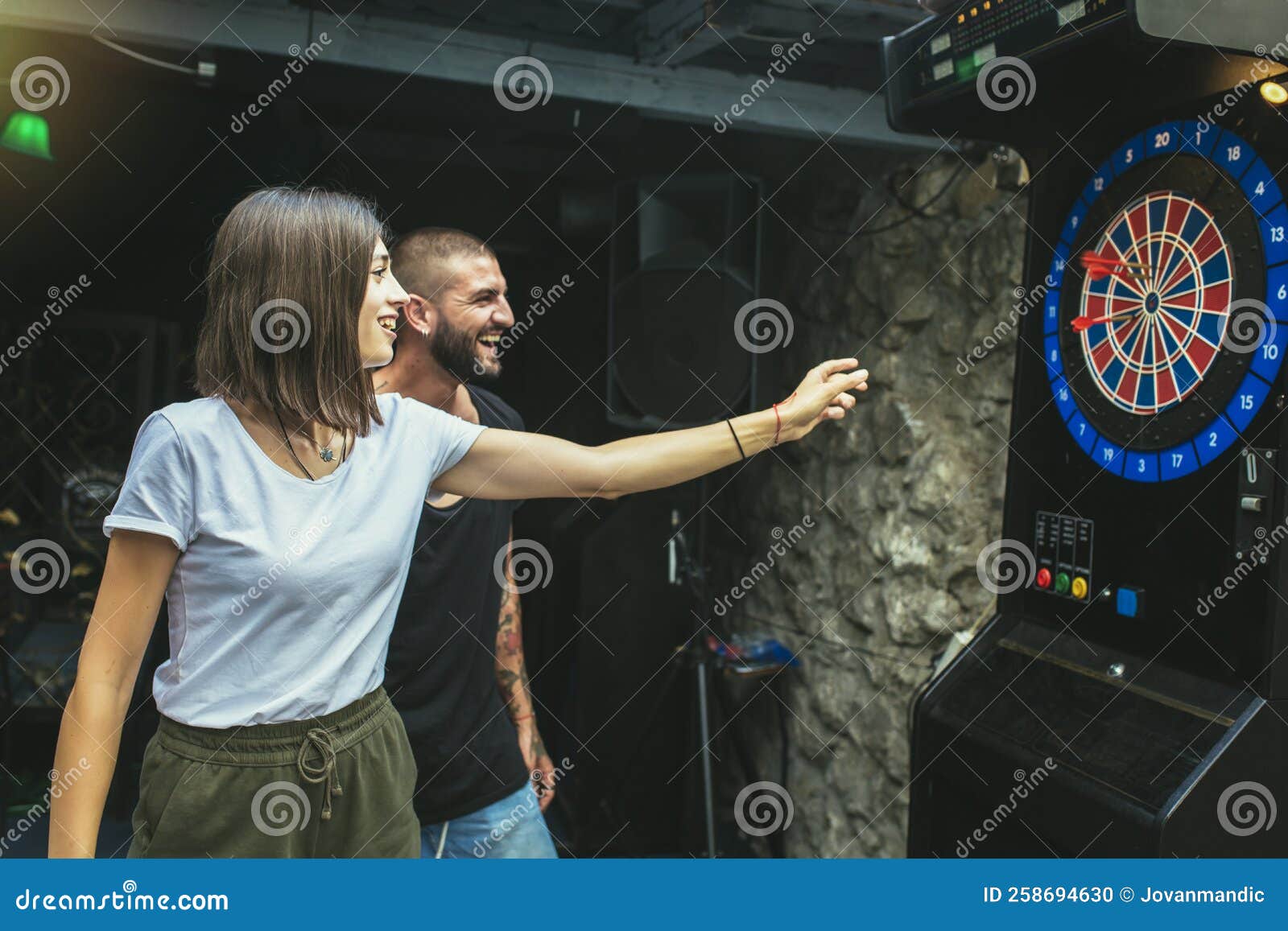 Young Attractive Couple Playing Darts Stock Photo - Image of casual ...