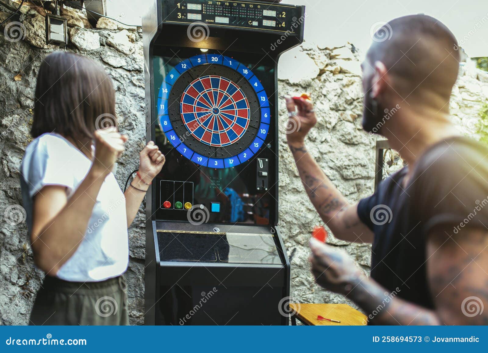 Young Attractive Couple Playing Darts Stock Image - Image of friend ...