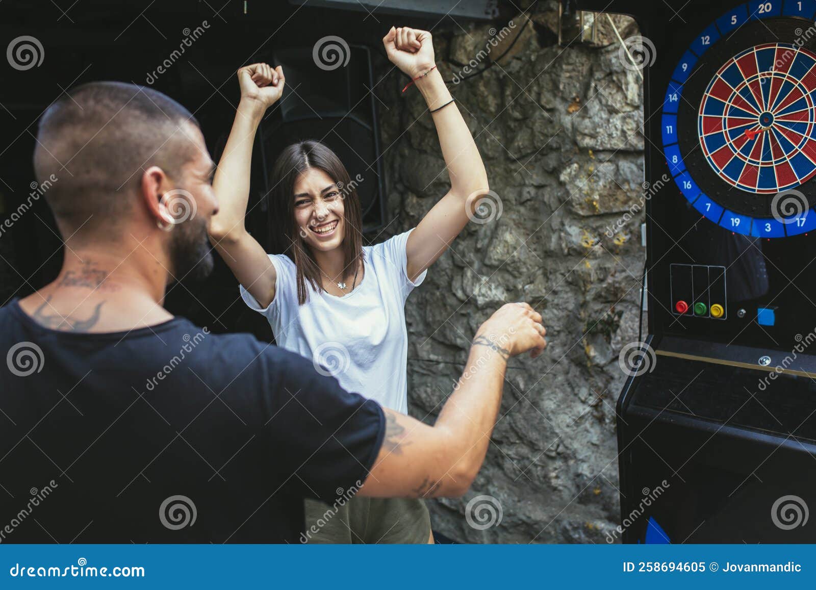 Young Attractive Couple Playing Darts Stock Image - Image of dart ...