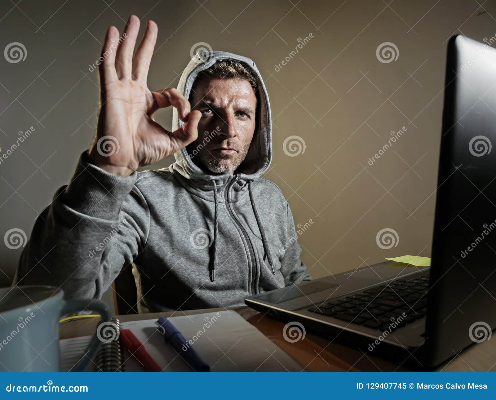 Young Attractive and Dangerous Looking Hacker Computer Geek Working on ...