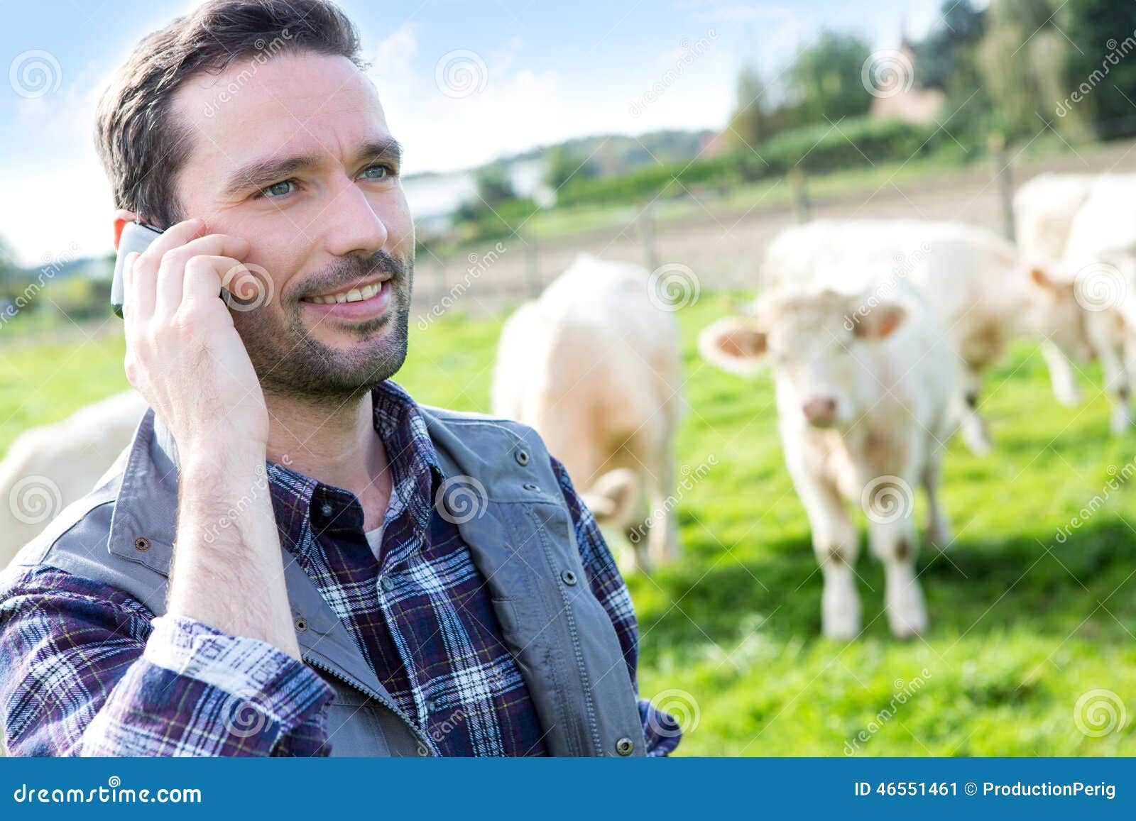 Young Attractive Farmer Using Mobile Phone in a Field Stock Image ...
