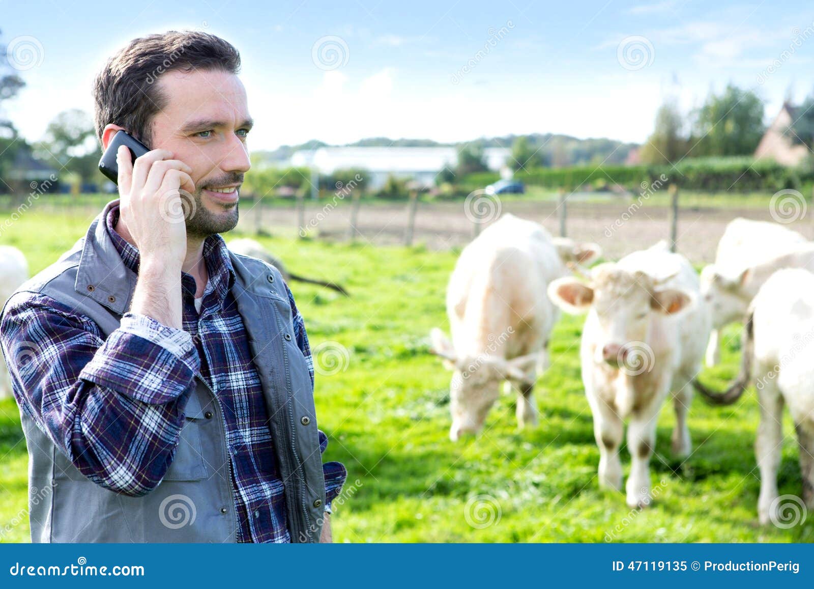 Young Attractive Farmer Using Mobile Phone in a Field Stock Image ...