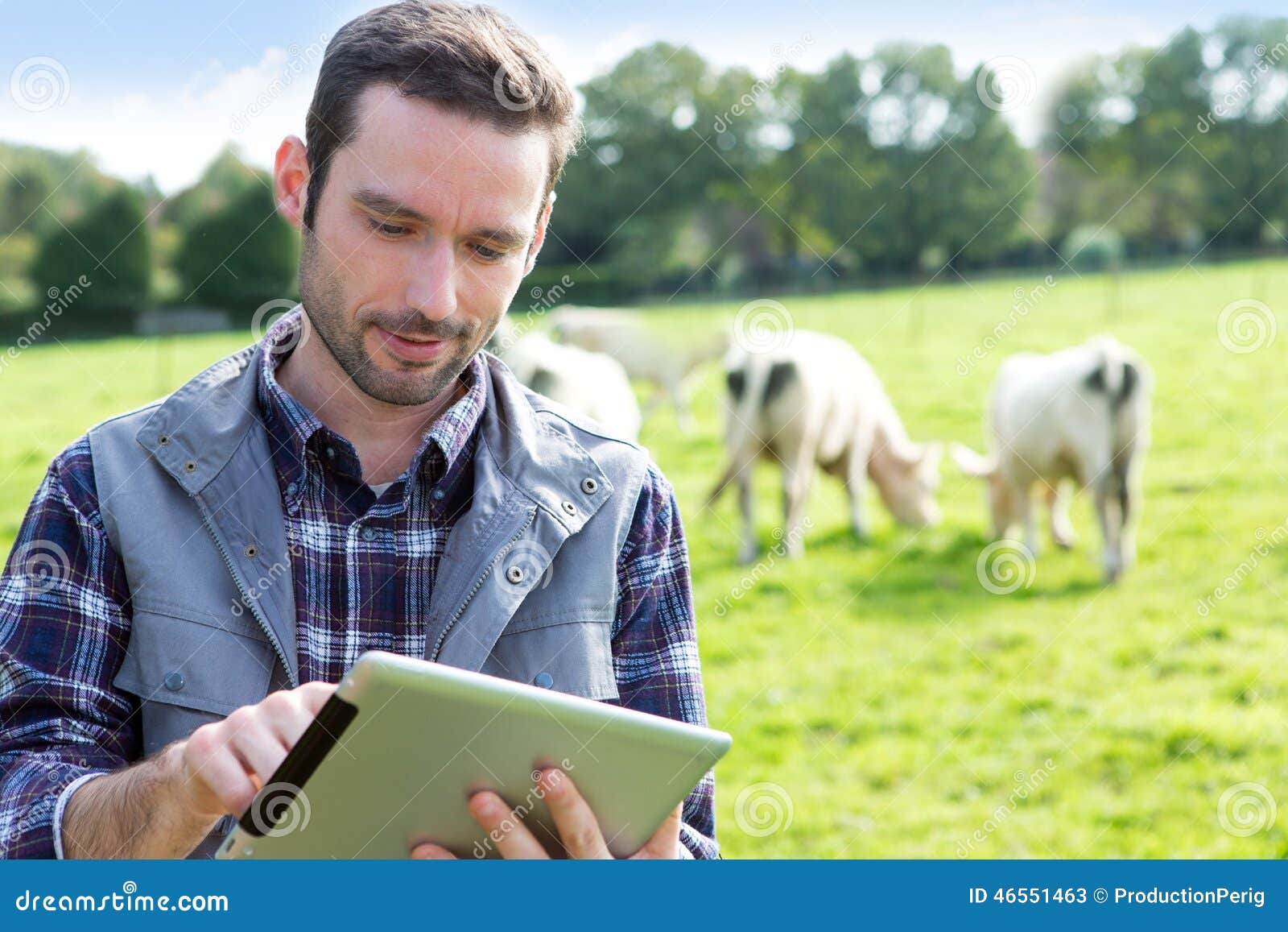 Young Attractive Farmer Using Tablet in a Field Stock Image - Image of ...
