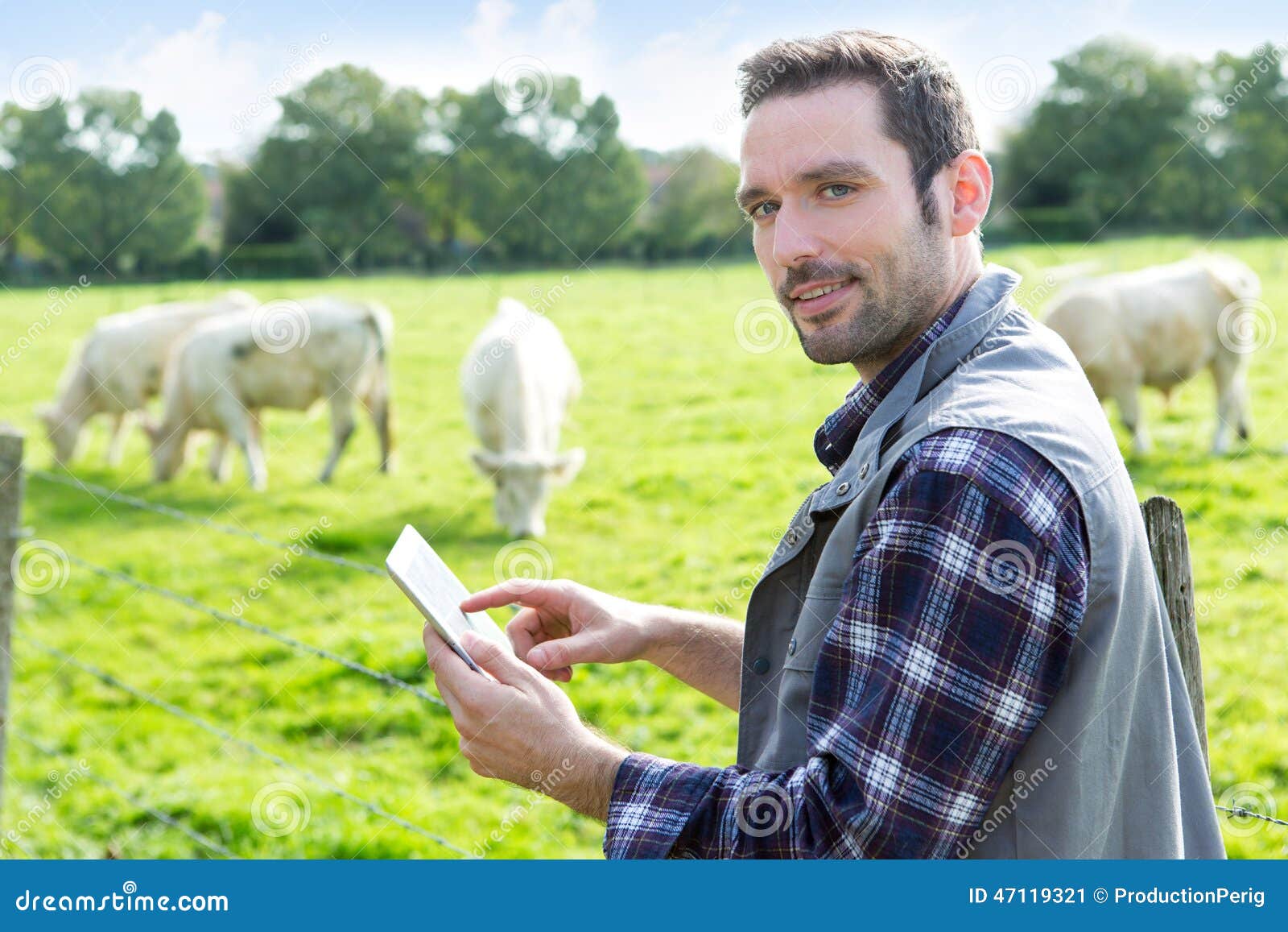 Young Attractive Farmer Using Tablet in a Field Stock Image - Image of ...