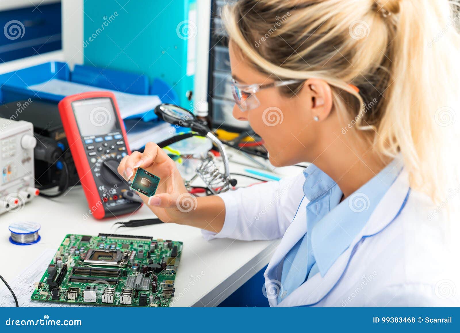 Female Electronic Engineer Checking CPU Microchip in Laboratory Stock ...
