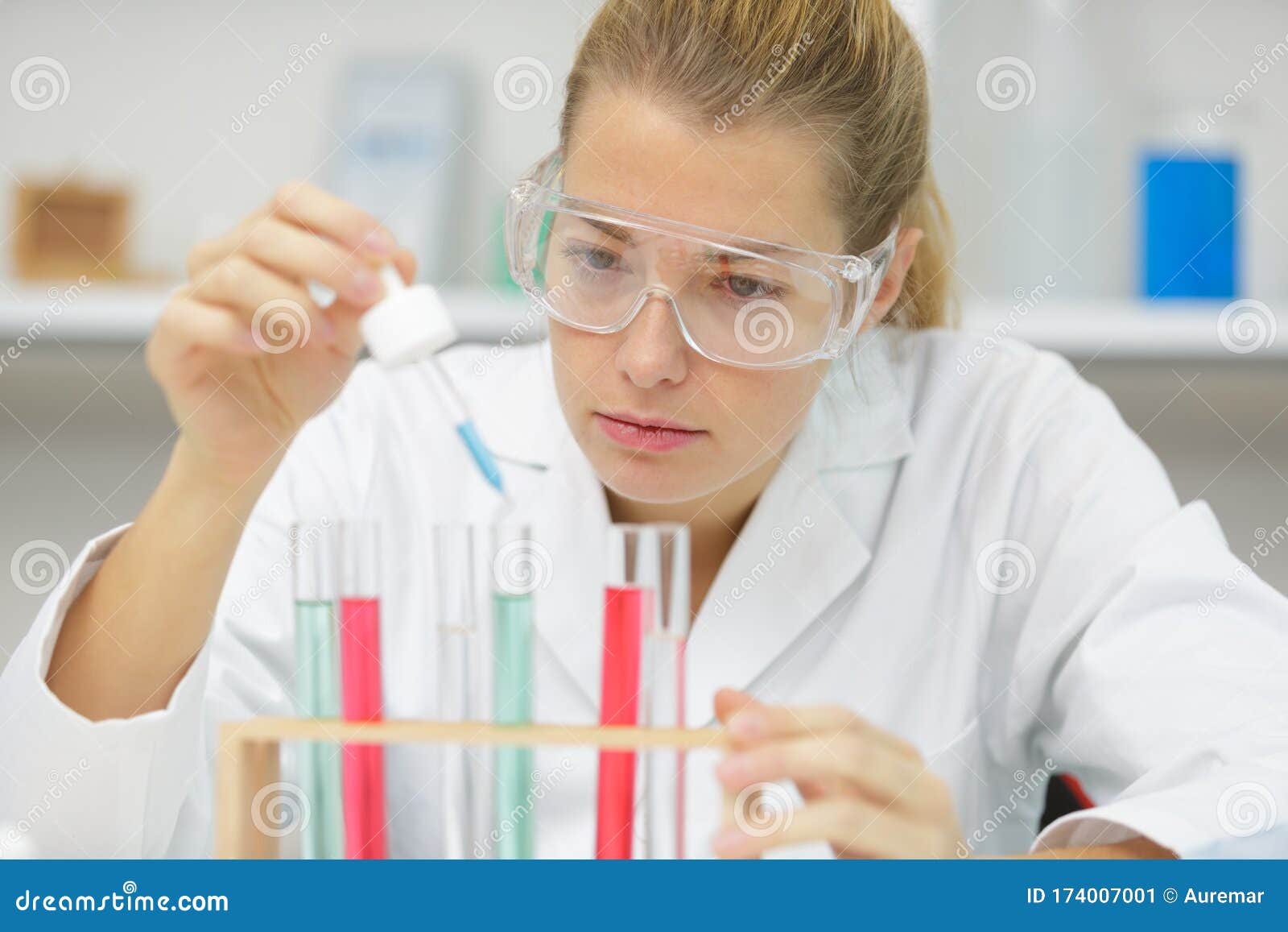 Young Attractive Female Scientist Holding Flask with Liquid Stock Image ...