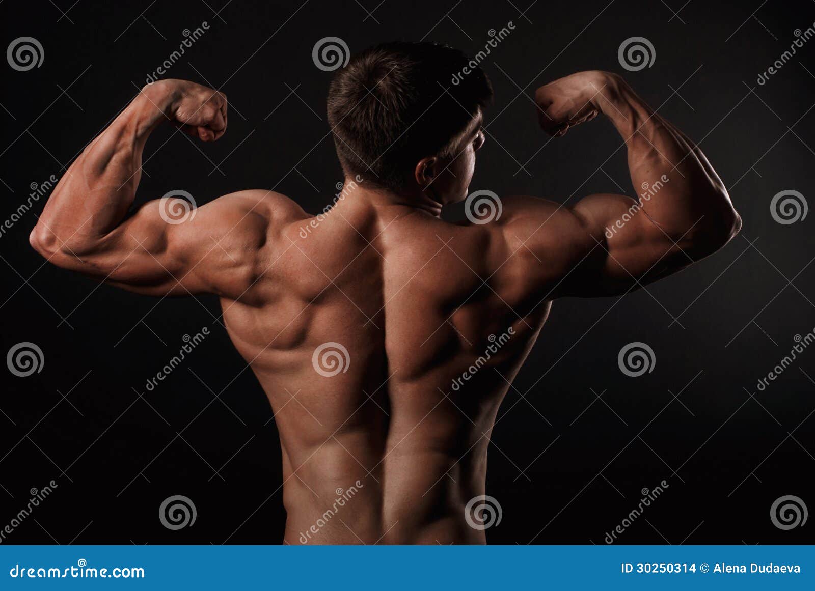 Young Attractive Man in a Black Bathing Suit Bodybuilder Stock Photo ...