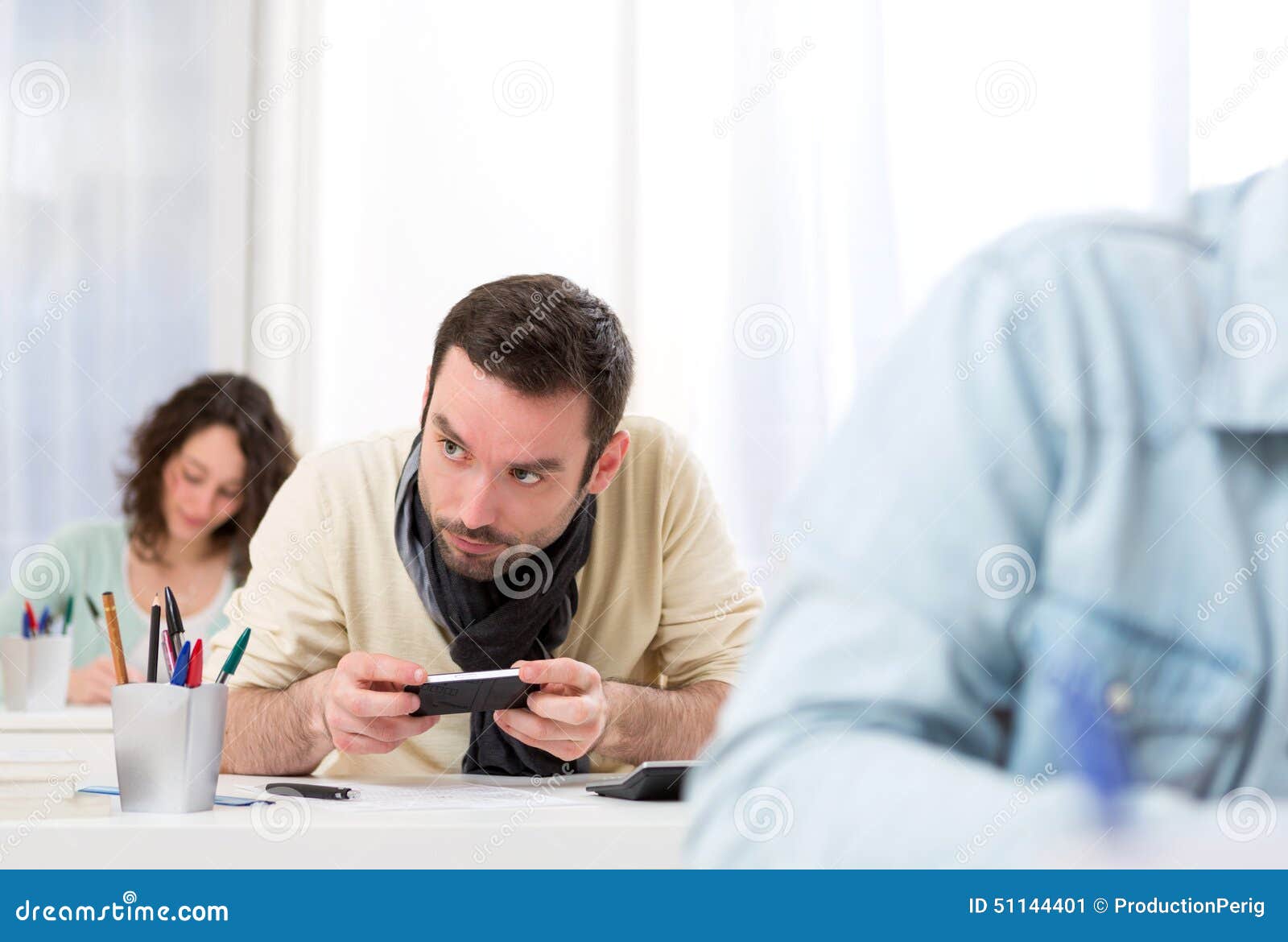 Young Attractive Man Cheating with Mobile during Exam Stock Image ...