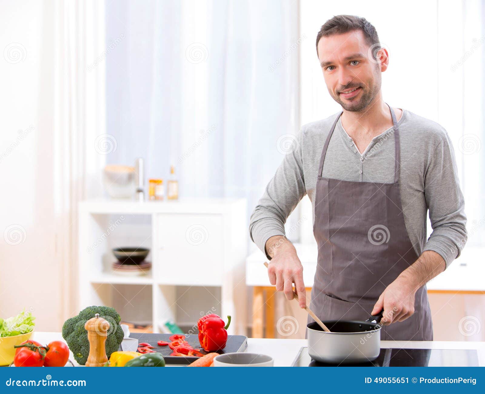 Young Attractive Man Cooking in a Kitchen Stock Image - Image of ...