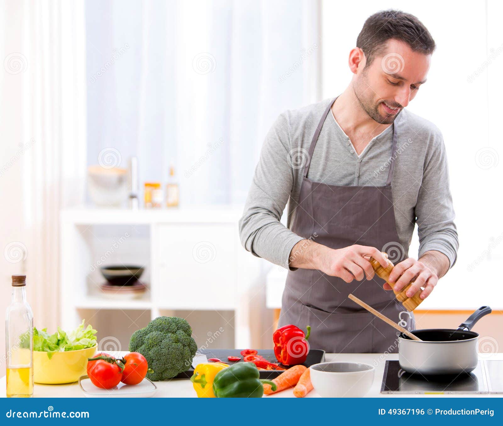 Young Attractive Man Cooking in a Kitchen Stock Photo - Image of happy ...